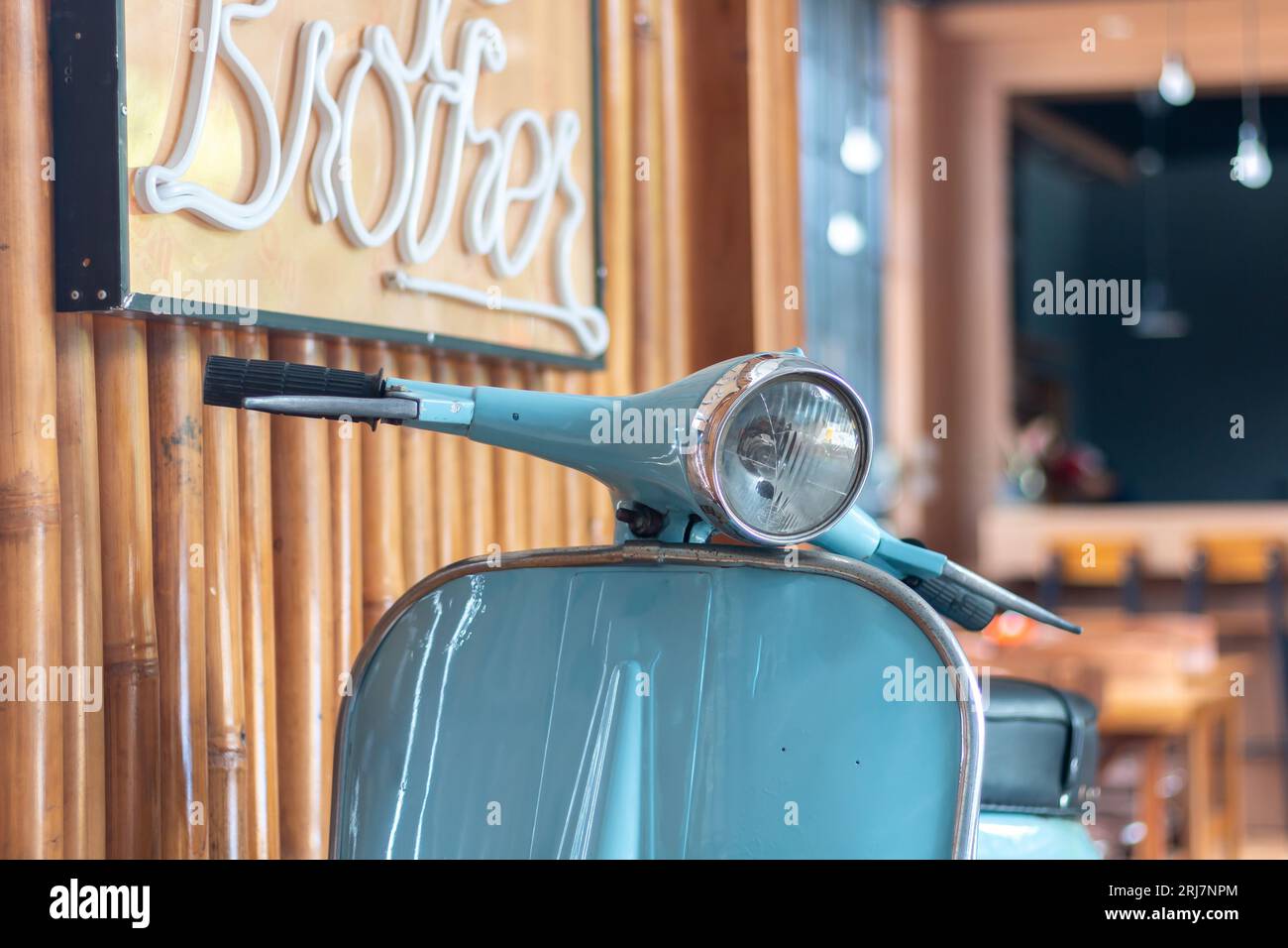 close up Blue vintage scooter in a cafe, feel warm, and unique Stock ...