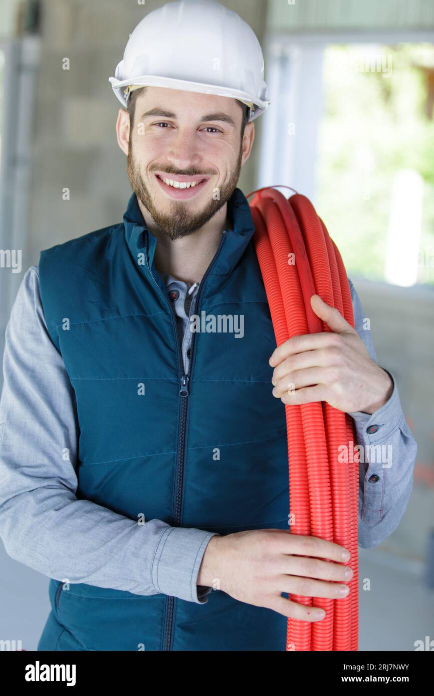 happy man during installation of pipes indoors Stock Photo - Alamy