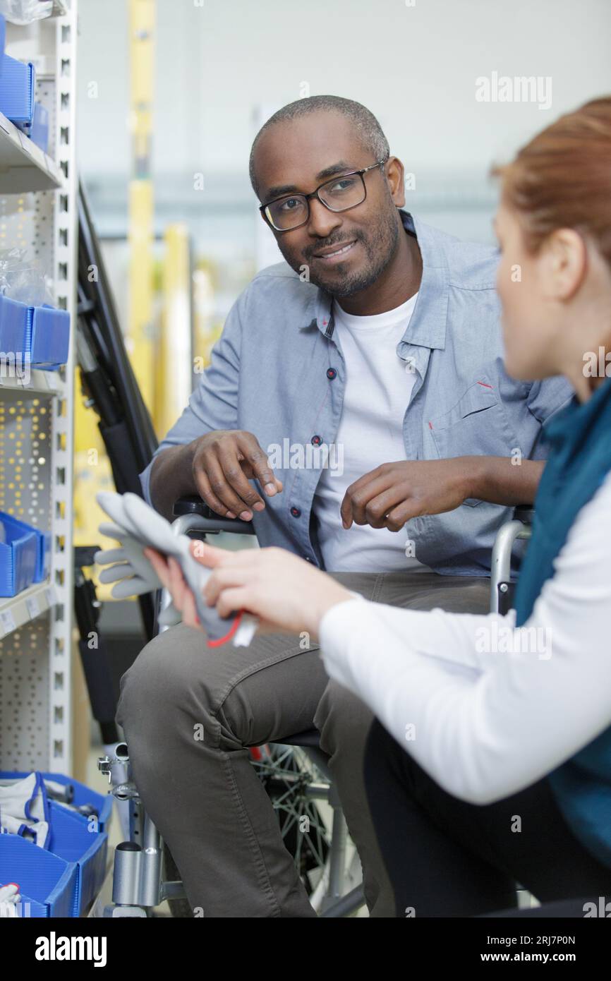 Sales man helping customer in store hi-res stock photography and images ...