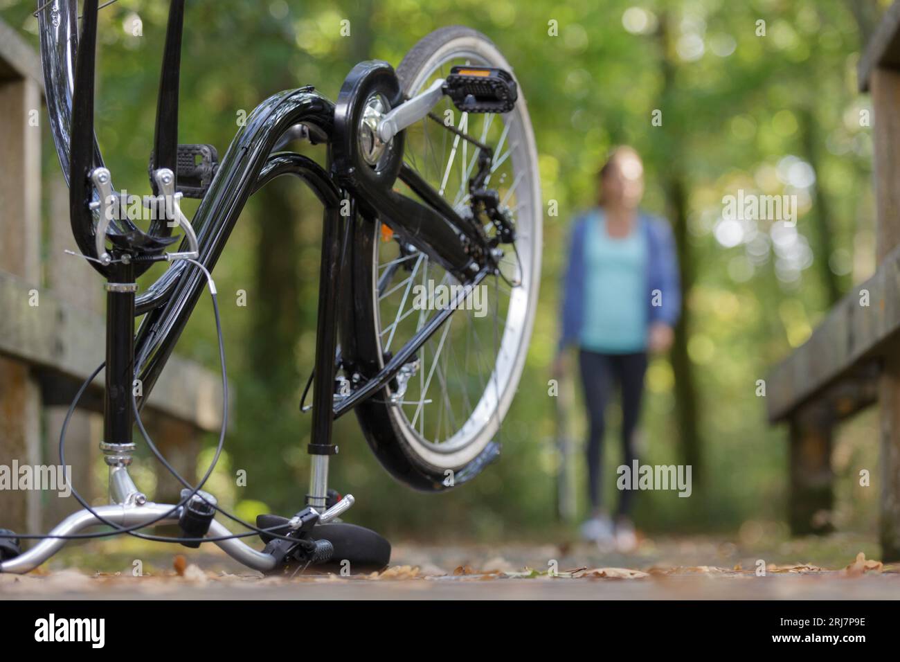 a man fastens and installs a bike over car roof Stock Photo - Alamy
