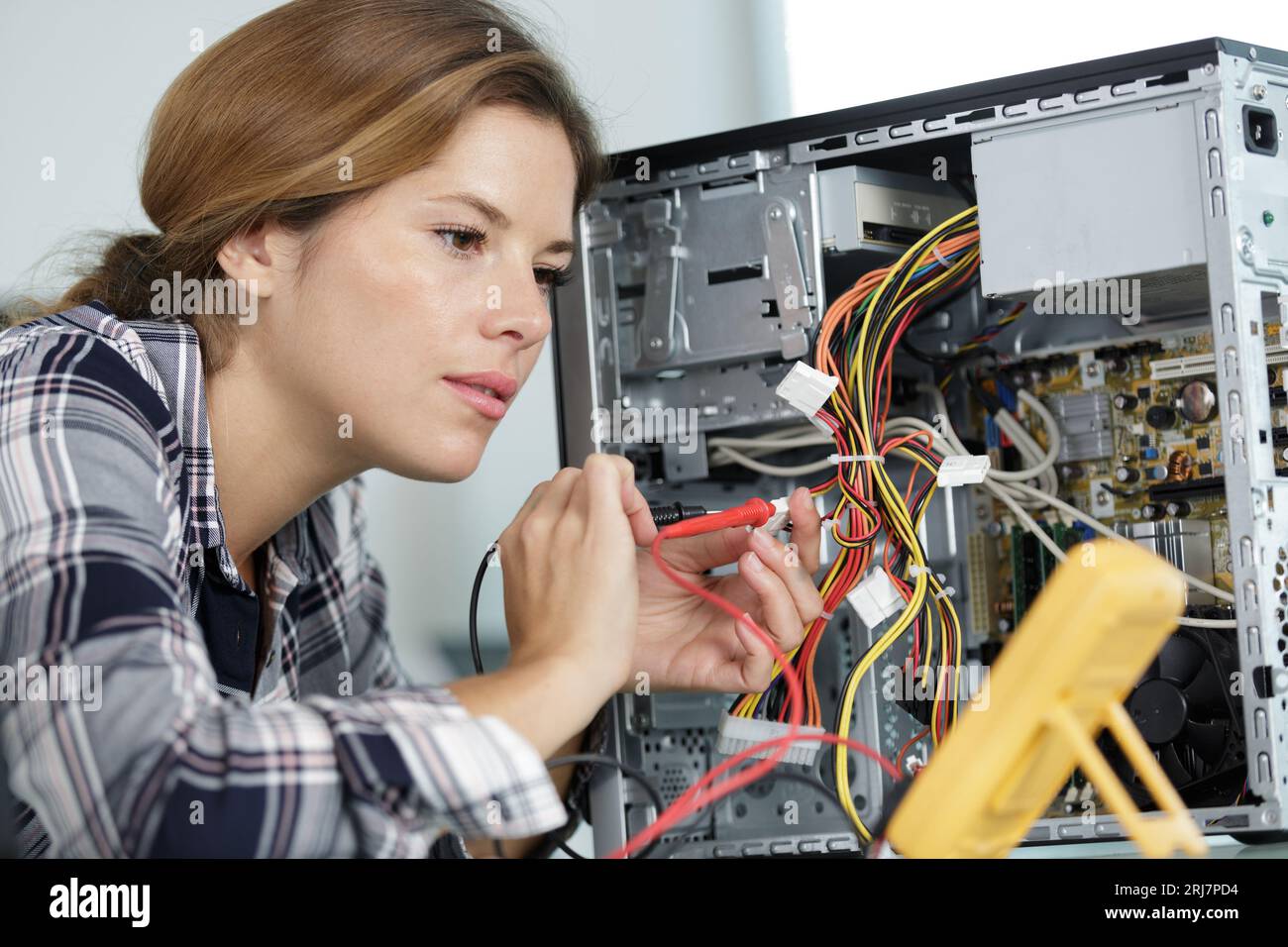 concentrated female fixing pc Stock Photo - Alamy