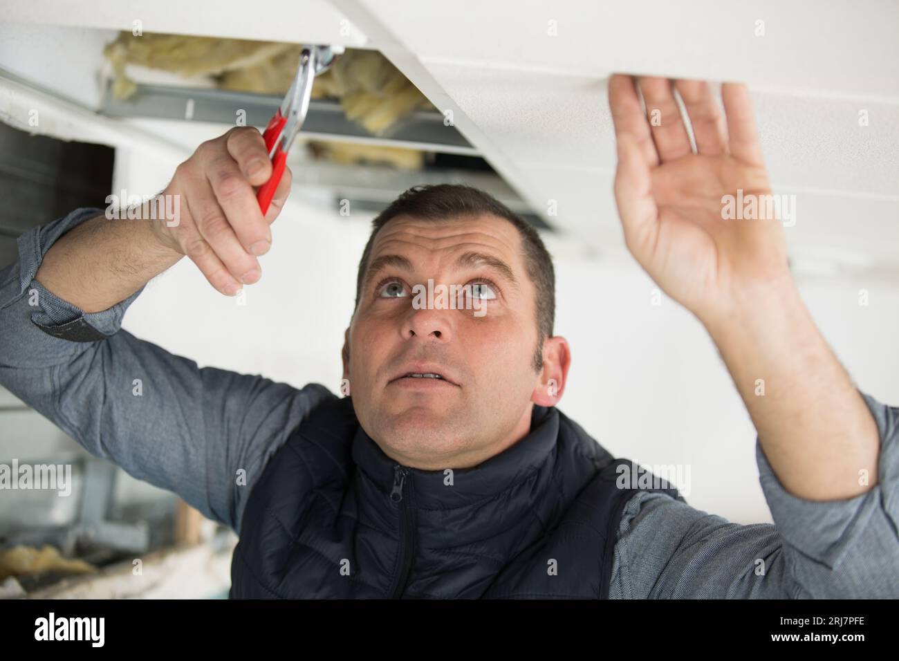 Male contractor on stepladder hi-res stock photography and images - Alamy