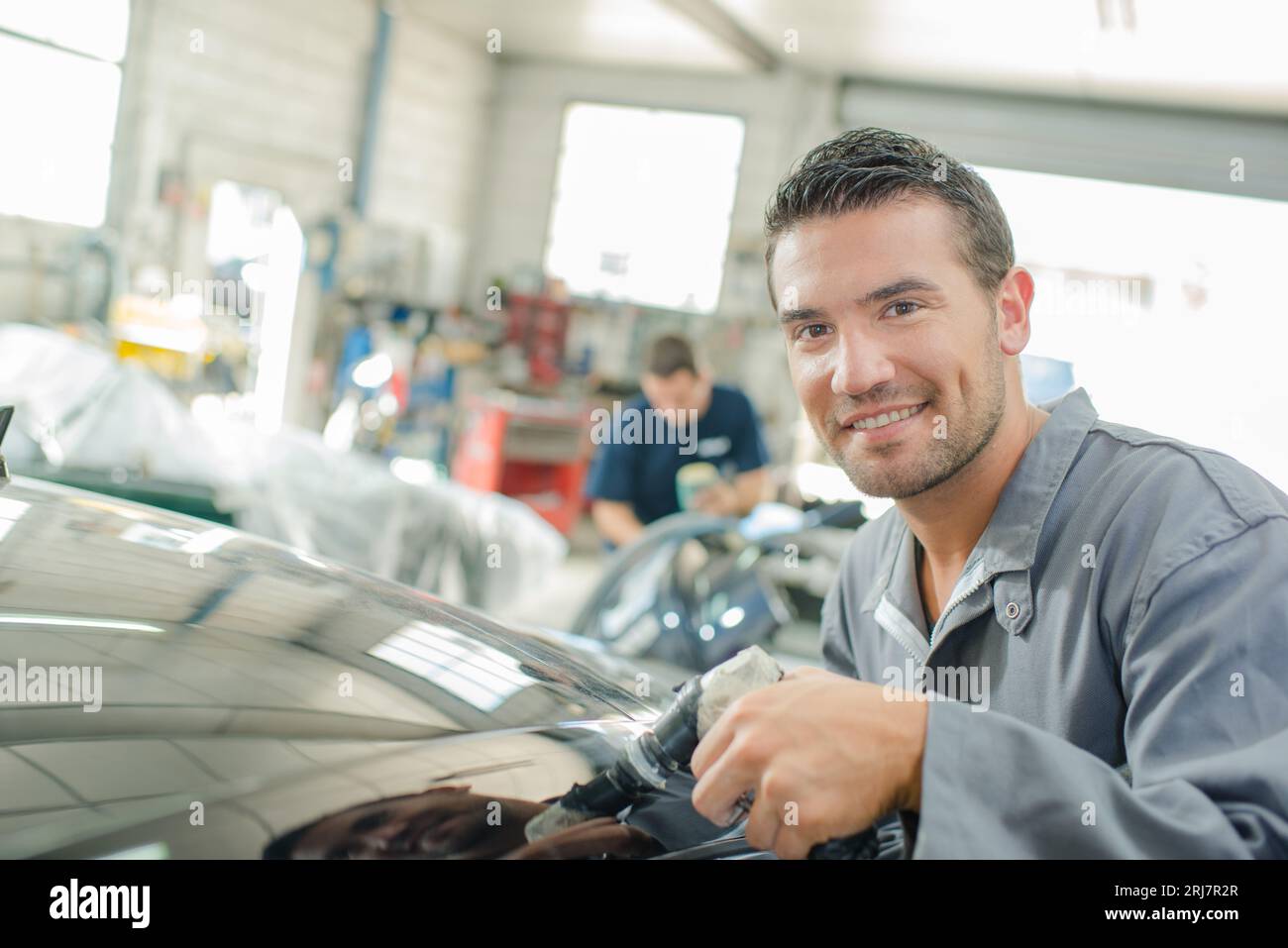 Mechanic polishing car frame hi-res stock photography and images - Alamy