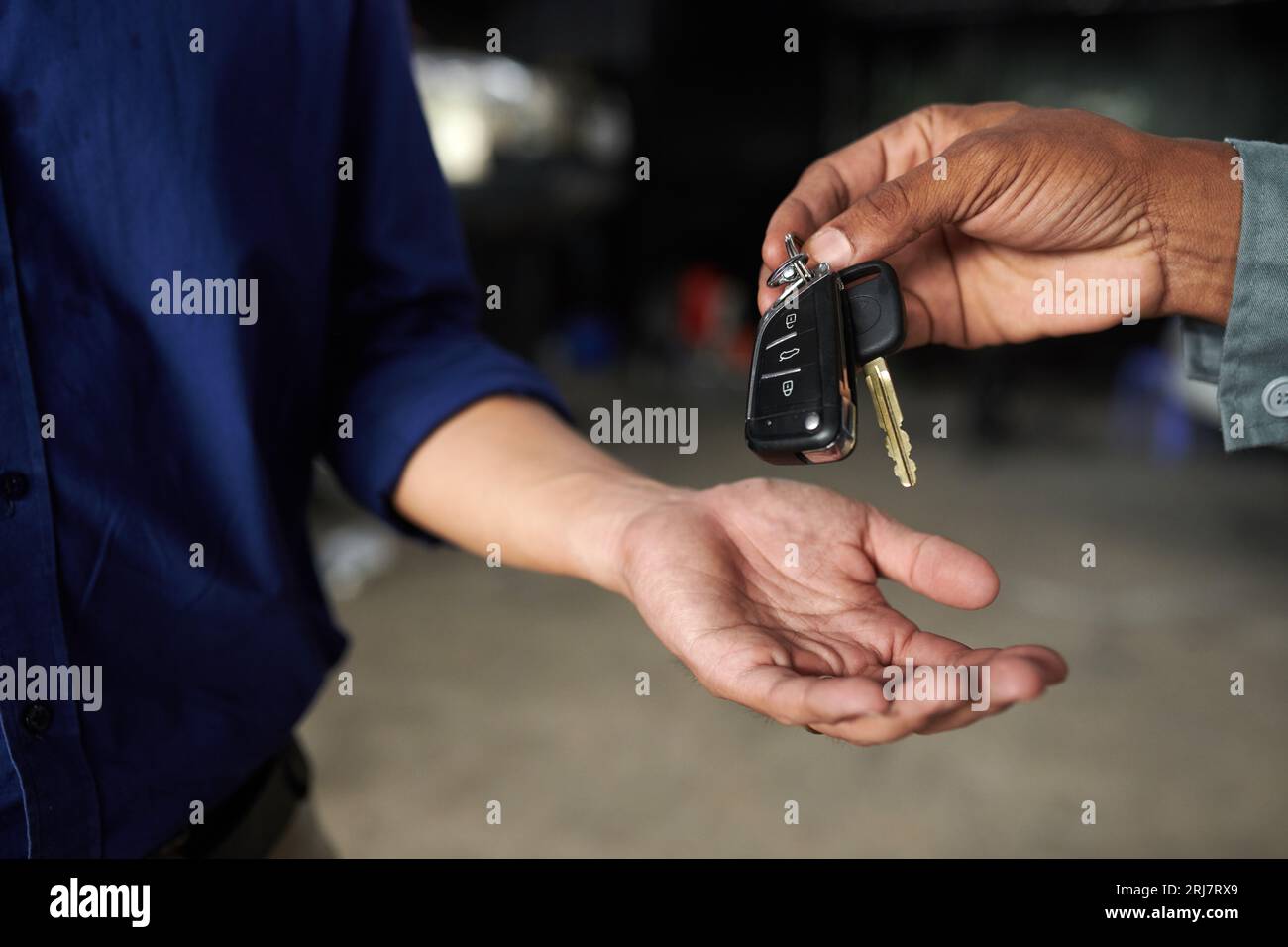 Mechanic man giving key customer hi-res stock photography and images ...