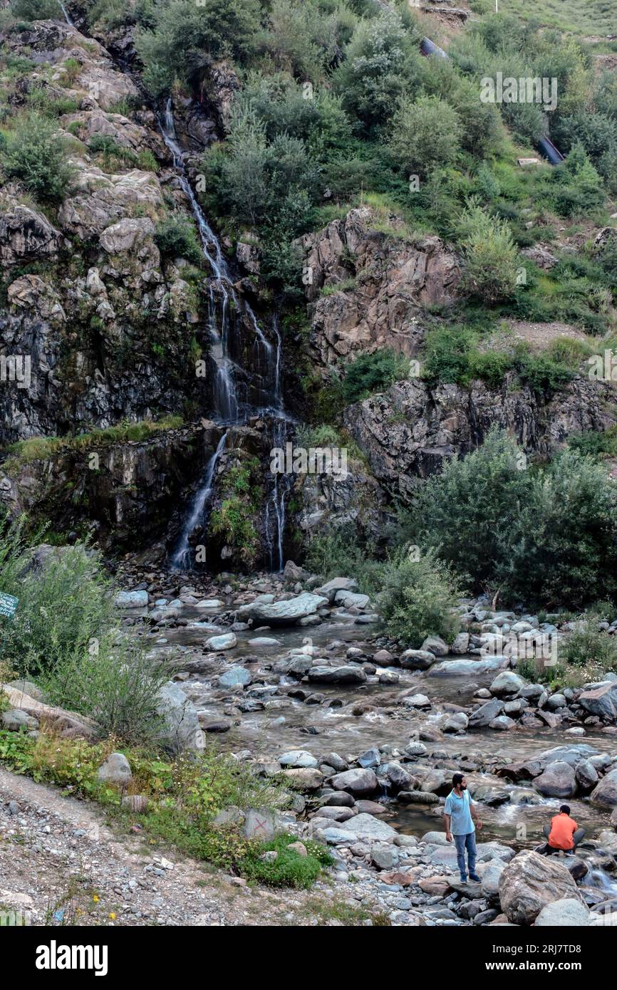 Drung, India. 21st Aug, 2023. Visitors explore the Drung waterfall ...