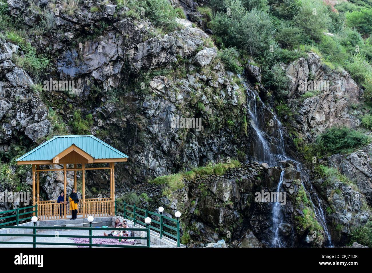 Drung, India. 21st Aug, 2023. Visitors explore the Drung waterfall ...