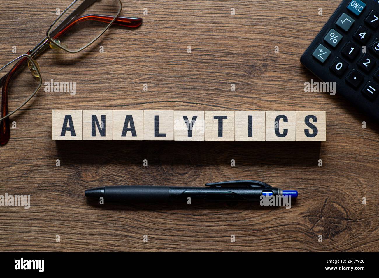 Analytics - word concept on building blocks, text Stock Photo - Alamy