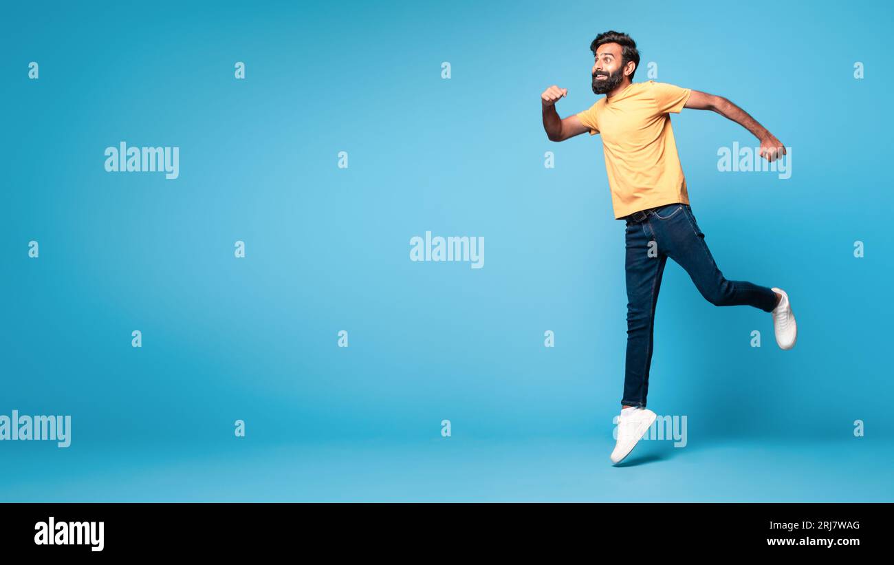 Happy indian man in jumper hi-res stock photography and images - Alamy