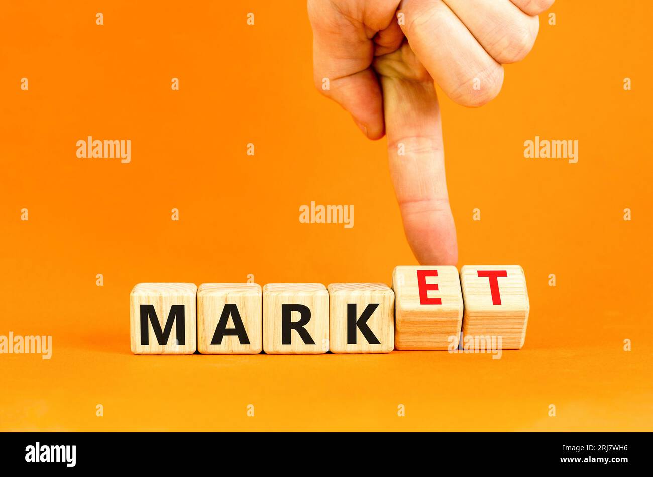 Mark of market symbol. Businessman turns wooden cubes and changes word ...