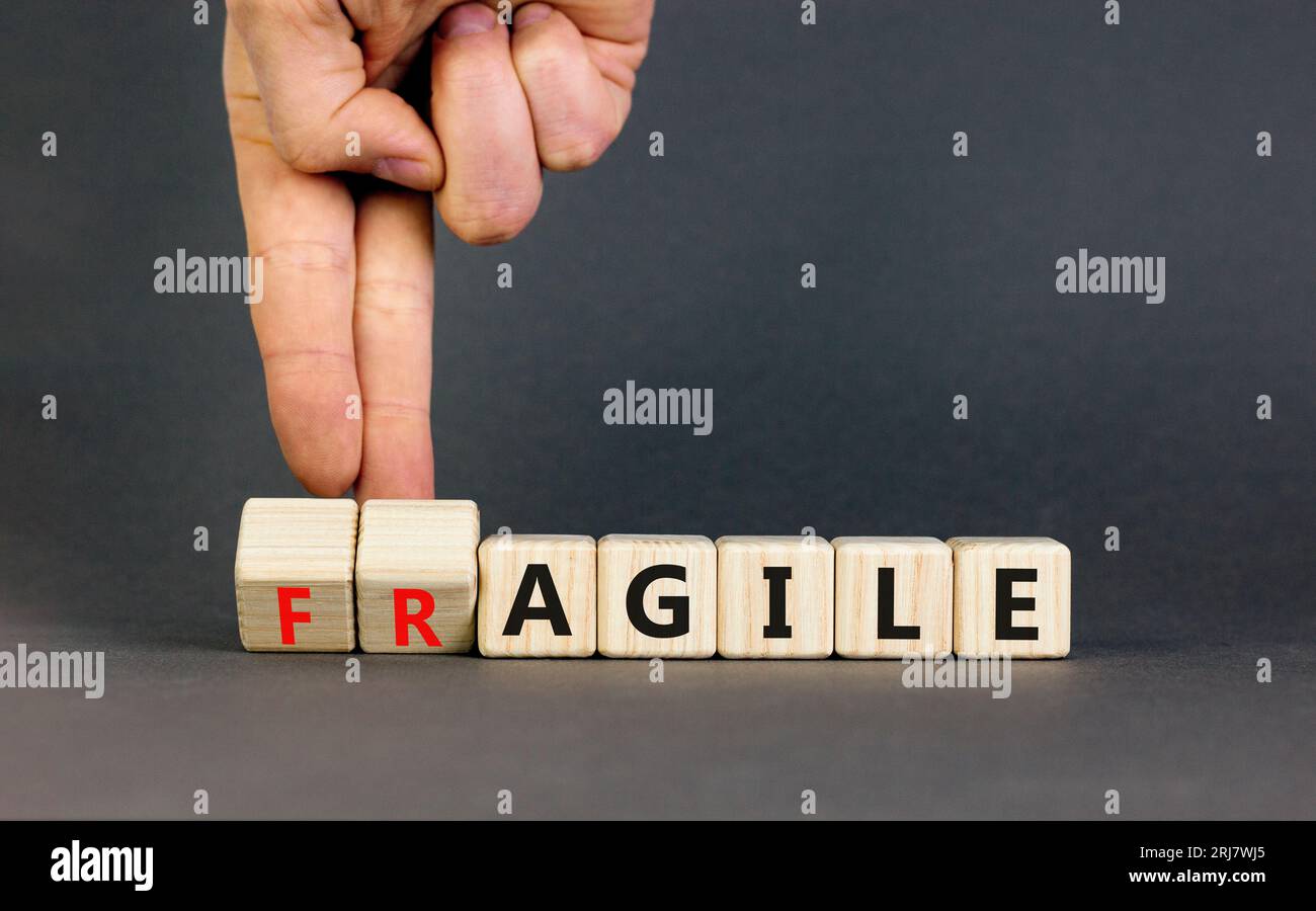 Agile or fragile symbol. Concept words Agile and Fragile on wooden ...