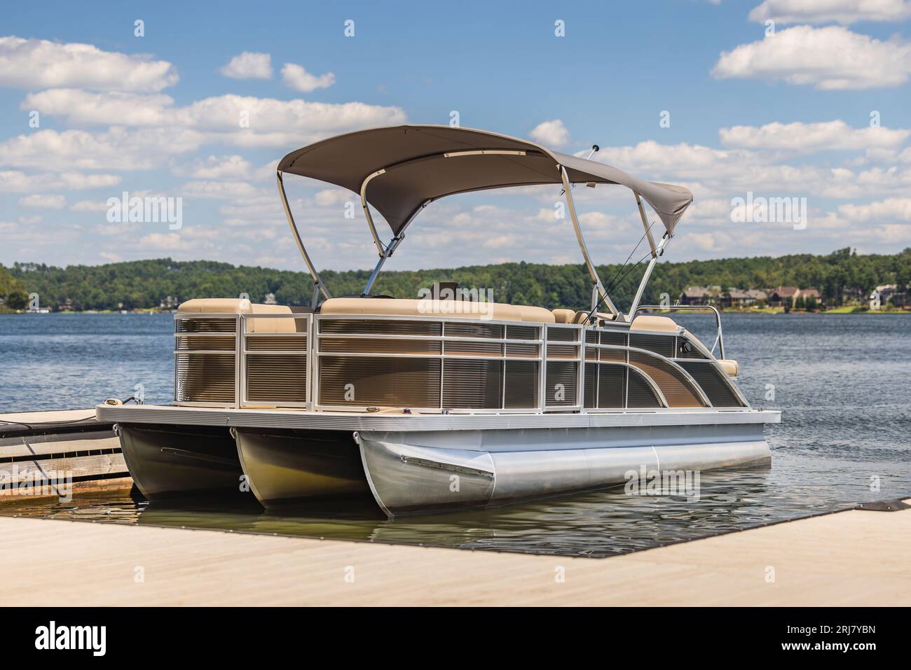 Pontoon boat at private marina dock on freshwater lake Stock Photo - Alamy