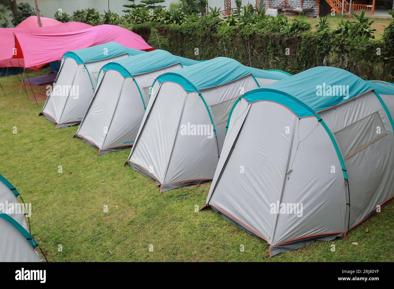 Camping and tent in the riverside. Panoramic landscape. Natural area ...