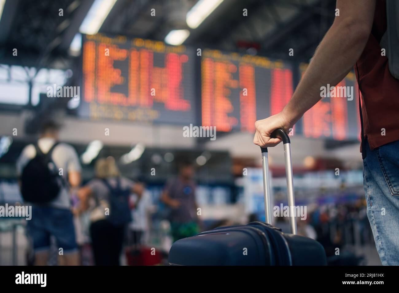 Traveling by airplane. Man waiting in airport terminal. Selective focus ...