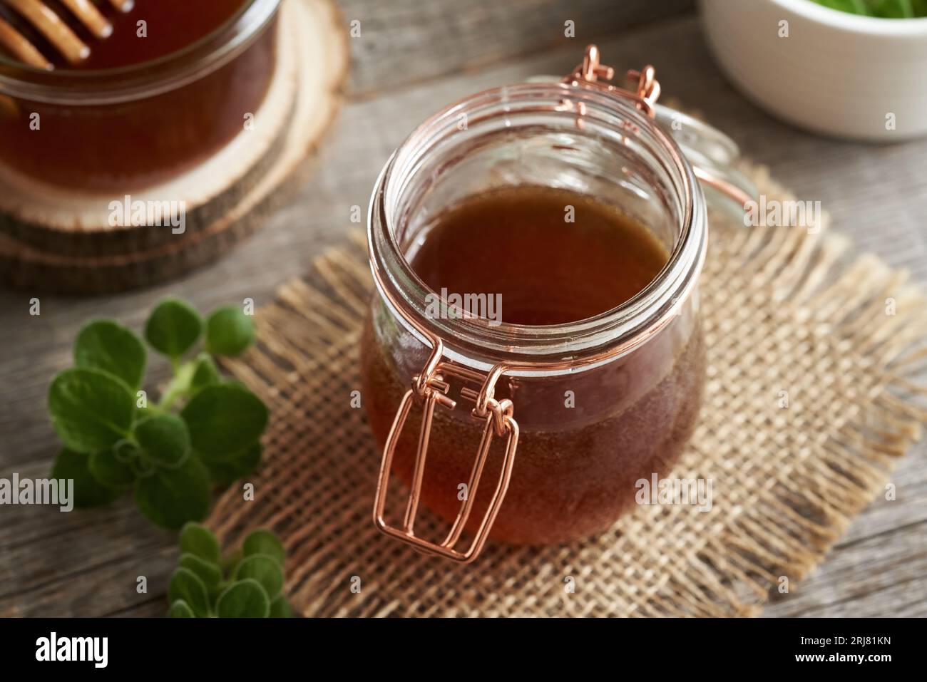 Homemade Plectranthus amboinicus syrup for common cold, on a table ...