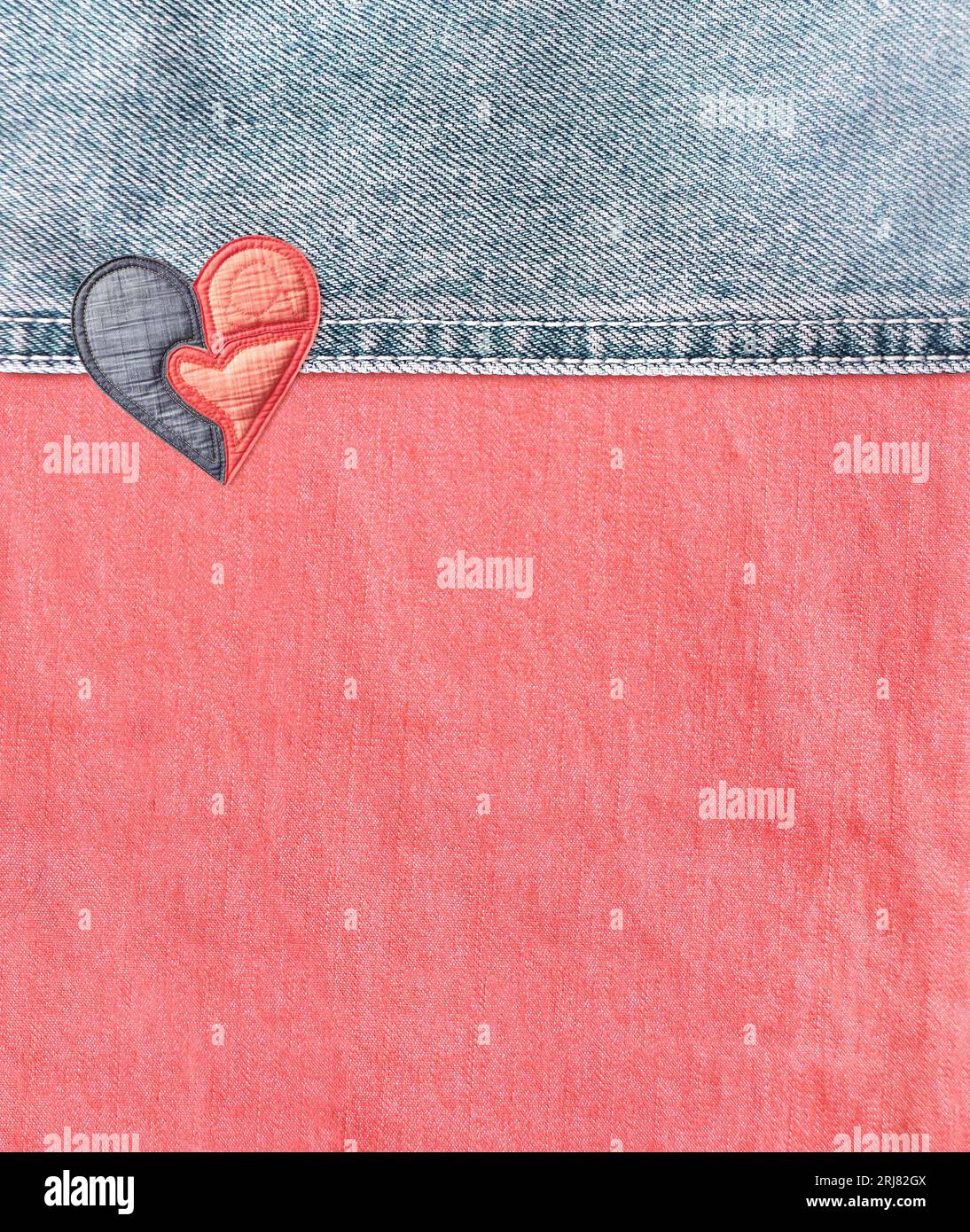 Pink and light blue denim background with a seam and felt heart. Coral ...