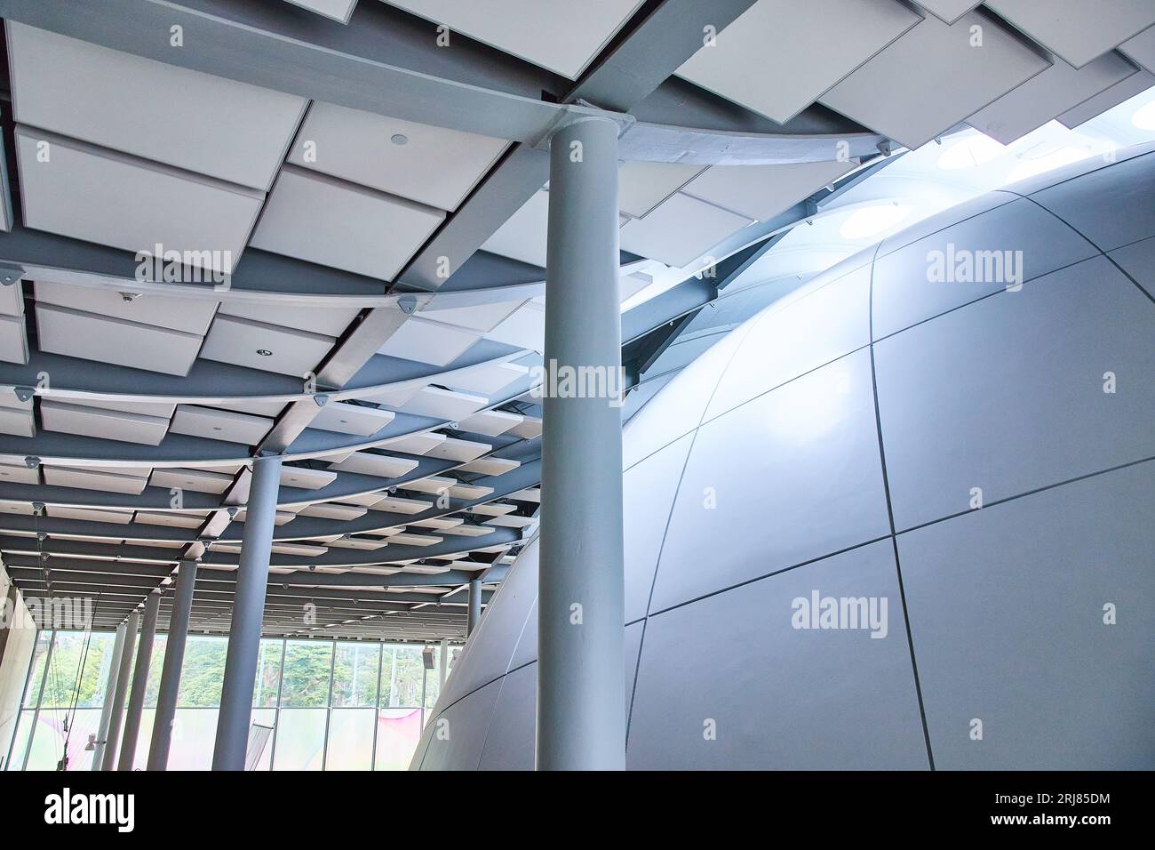 Round white planetarium exterior with curving interior roof tiles of ...