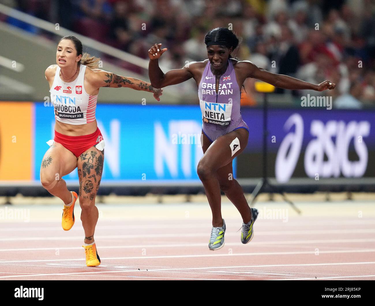 Great Britain's Daryll Neita (right) competes in heat 1 of the Women's ...
