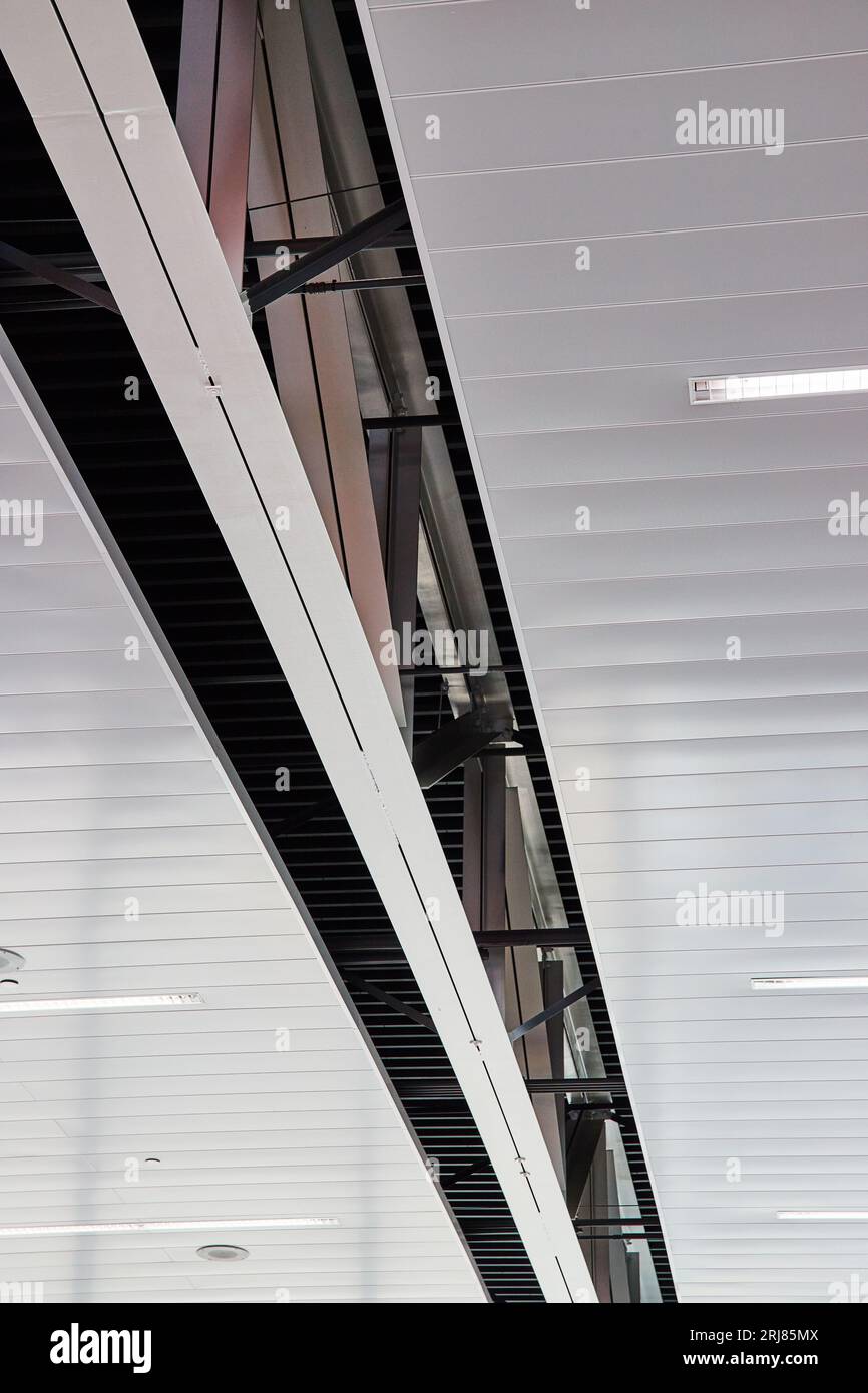 Abstract view of ceiling with metal slats and a single double metal ...