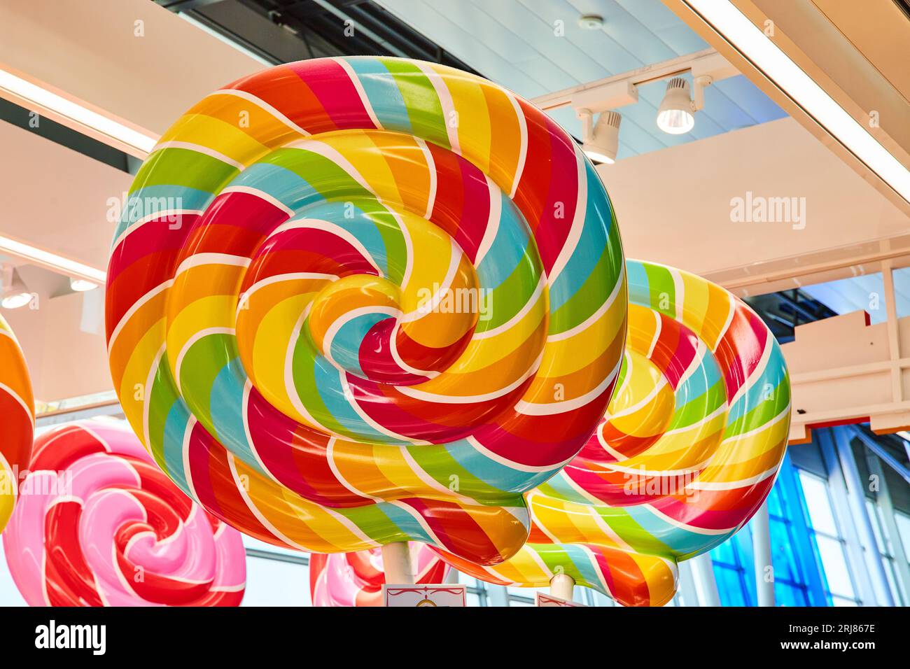 Brilliant large lollipop candy with multiple vibrant colors in rainbow ...