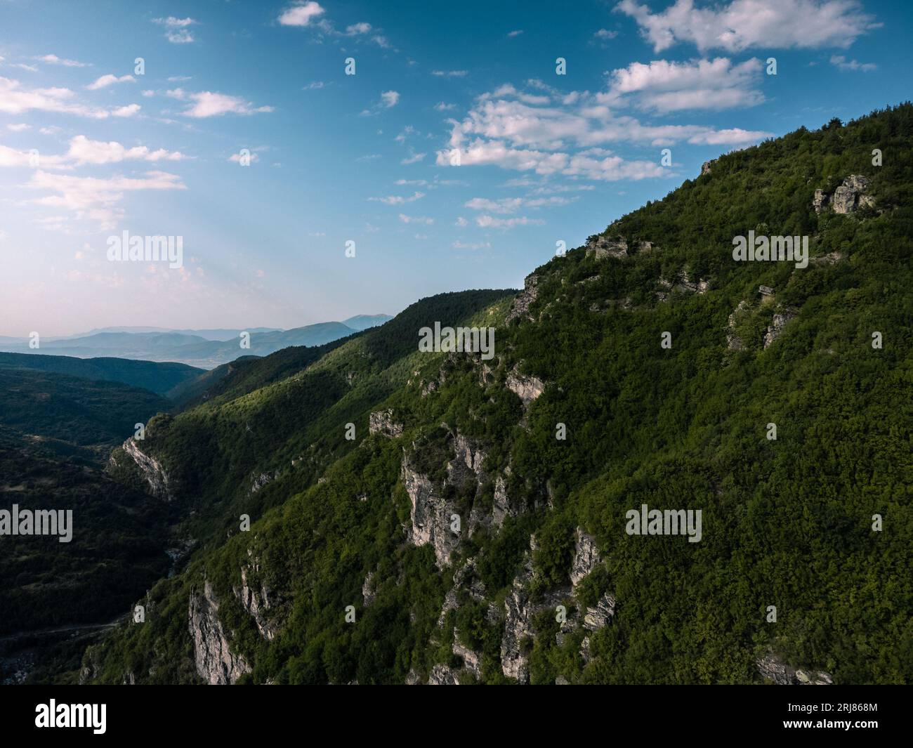 Deep blue sky with clouds and epic gigantic mountain with a lot of ...