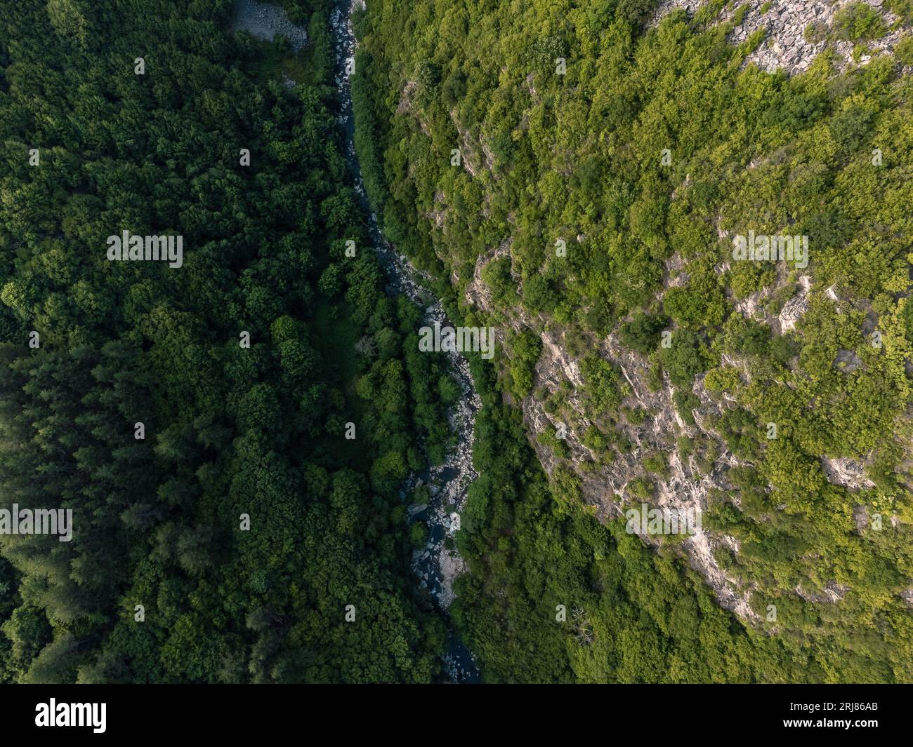 Above a river in between the valley. Shot with a drone Stock Photo - Alamy