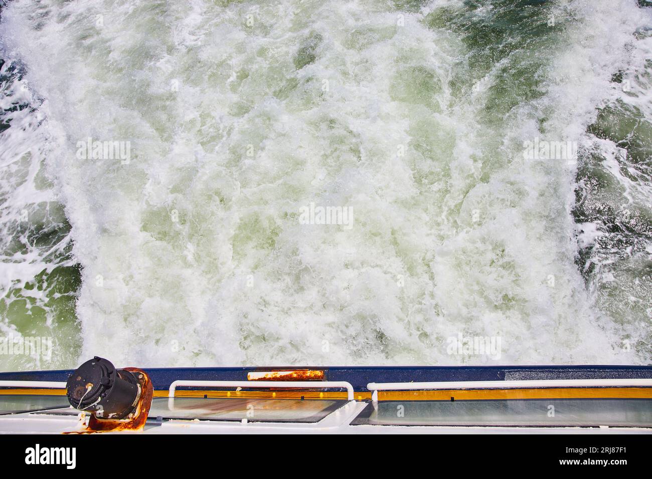 Stern of ship with very choppy white wake water Stock Photo - Alamy
