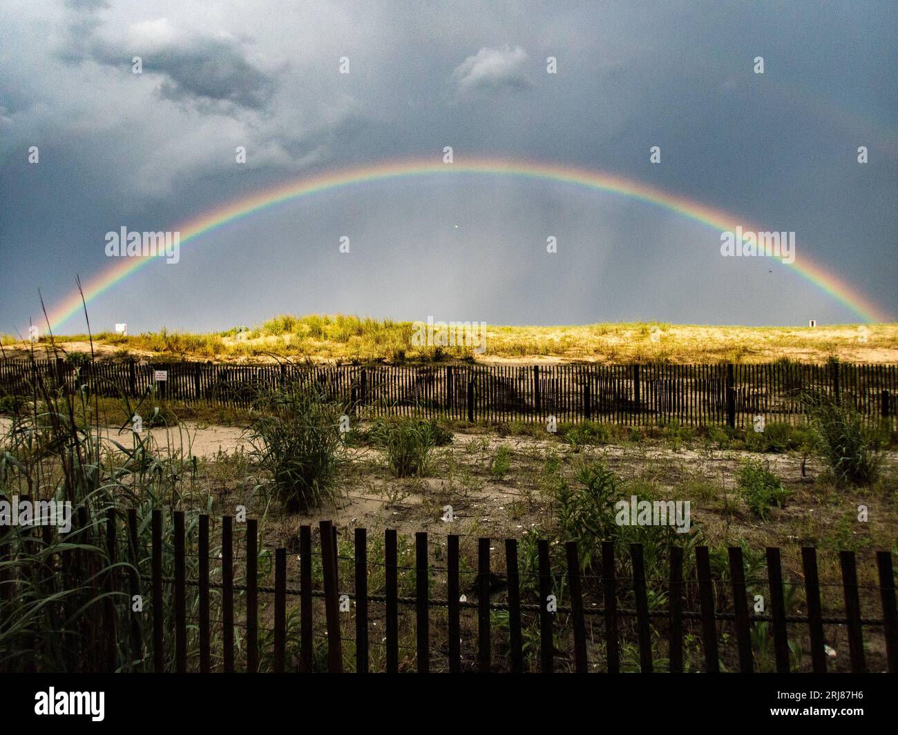 A rainbow forms after an afternoon storm in Ocean City, Maryland Stock ...