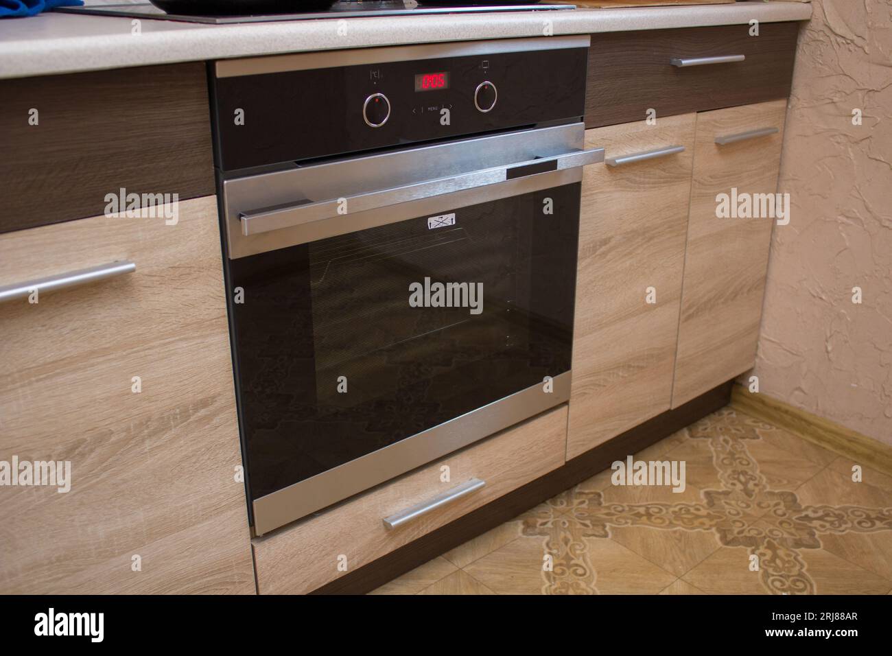 A new luxury electric oven built in furniture in the kitchen, touch ...