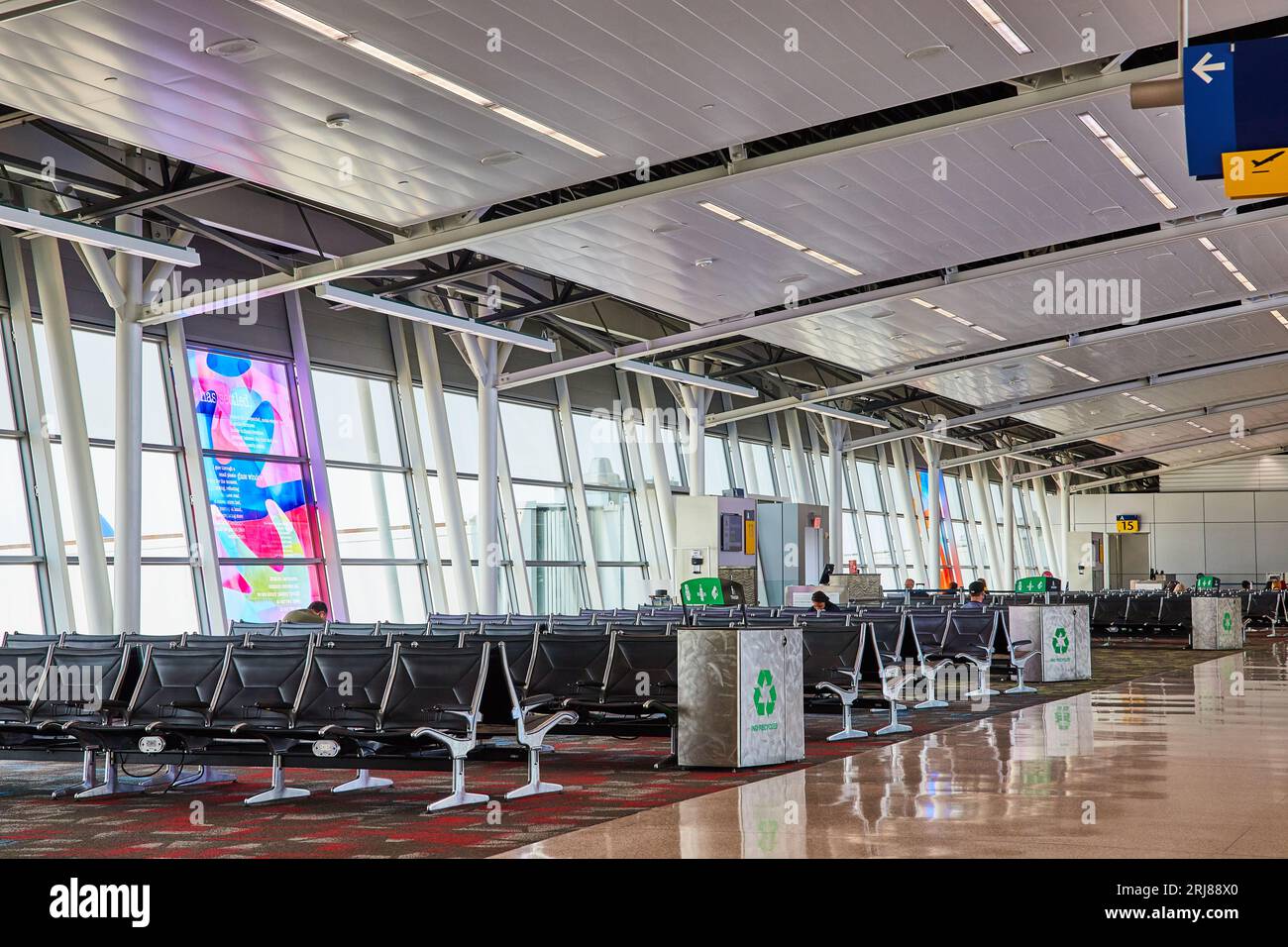 Airport terminal with two abstract window art pieces and recycling ...