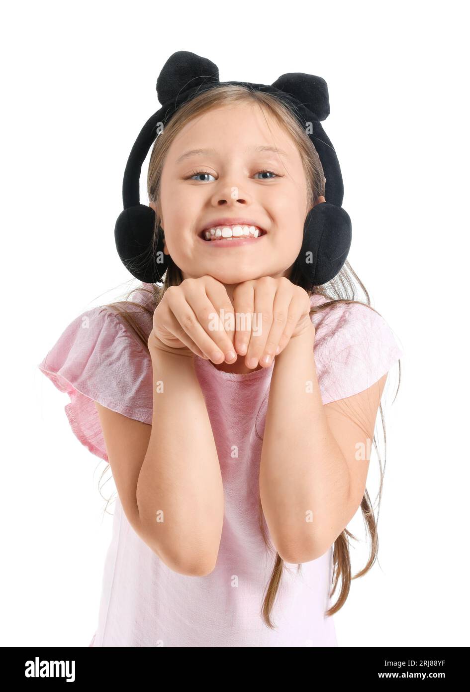 Little girl in cute headphones on white background Stock Photo - Alamy