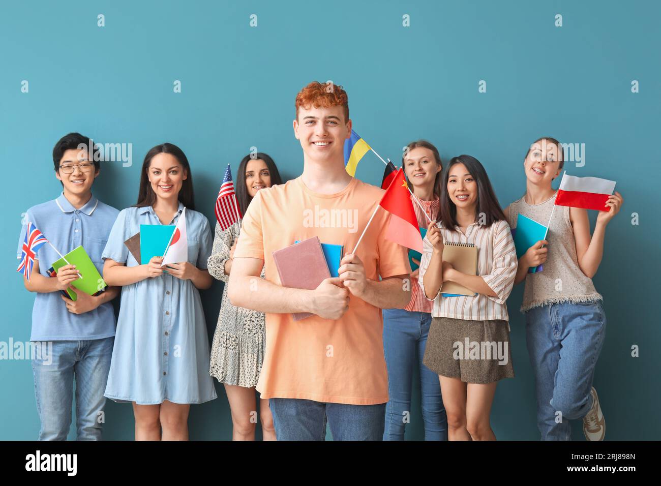 Young students of language school with flags on blue background Stock ...