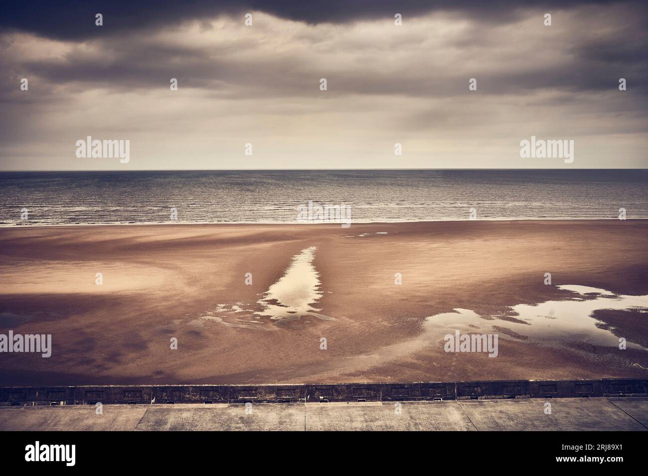 Beach and sea in bad weather Stock Photo - Alamy
