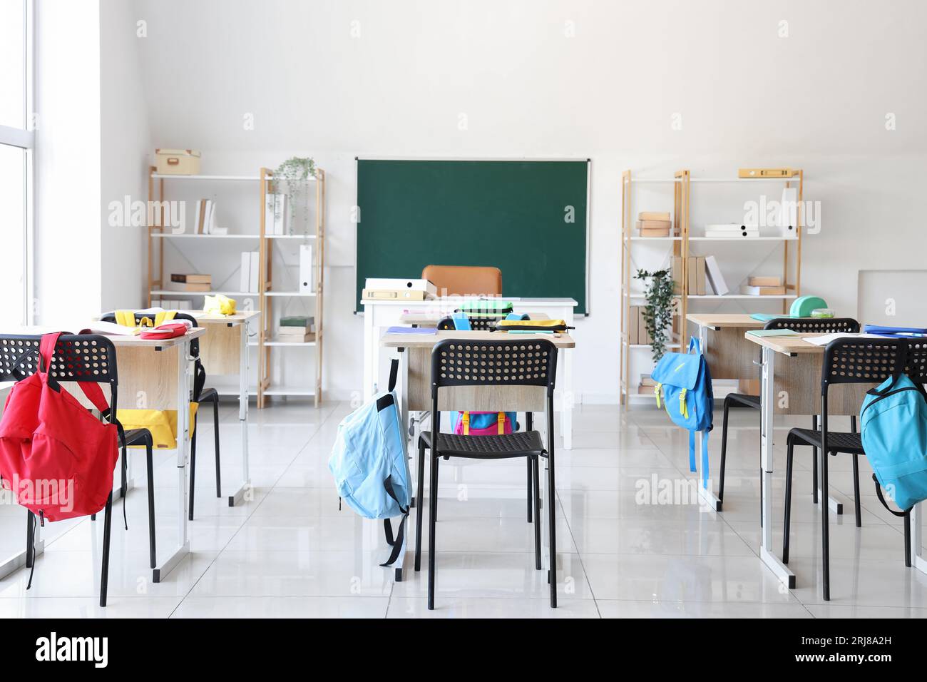 Interior of modern classroom with desks and chairs at school Stock ...
