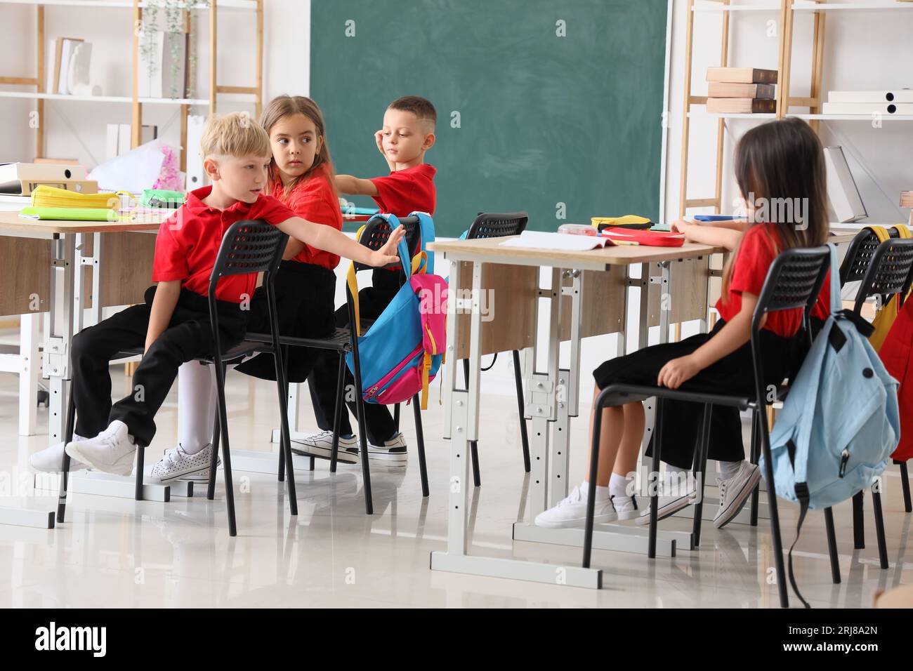 Little school children in classroom during lesson Stock Photo - Alamy