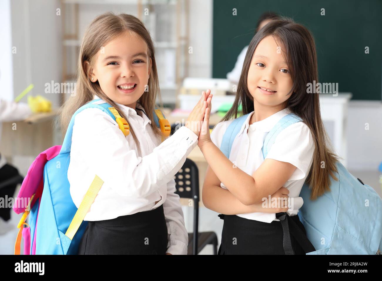 Little girls in classroom at school Stock Photo - Alamy