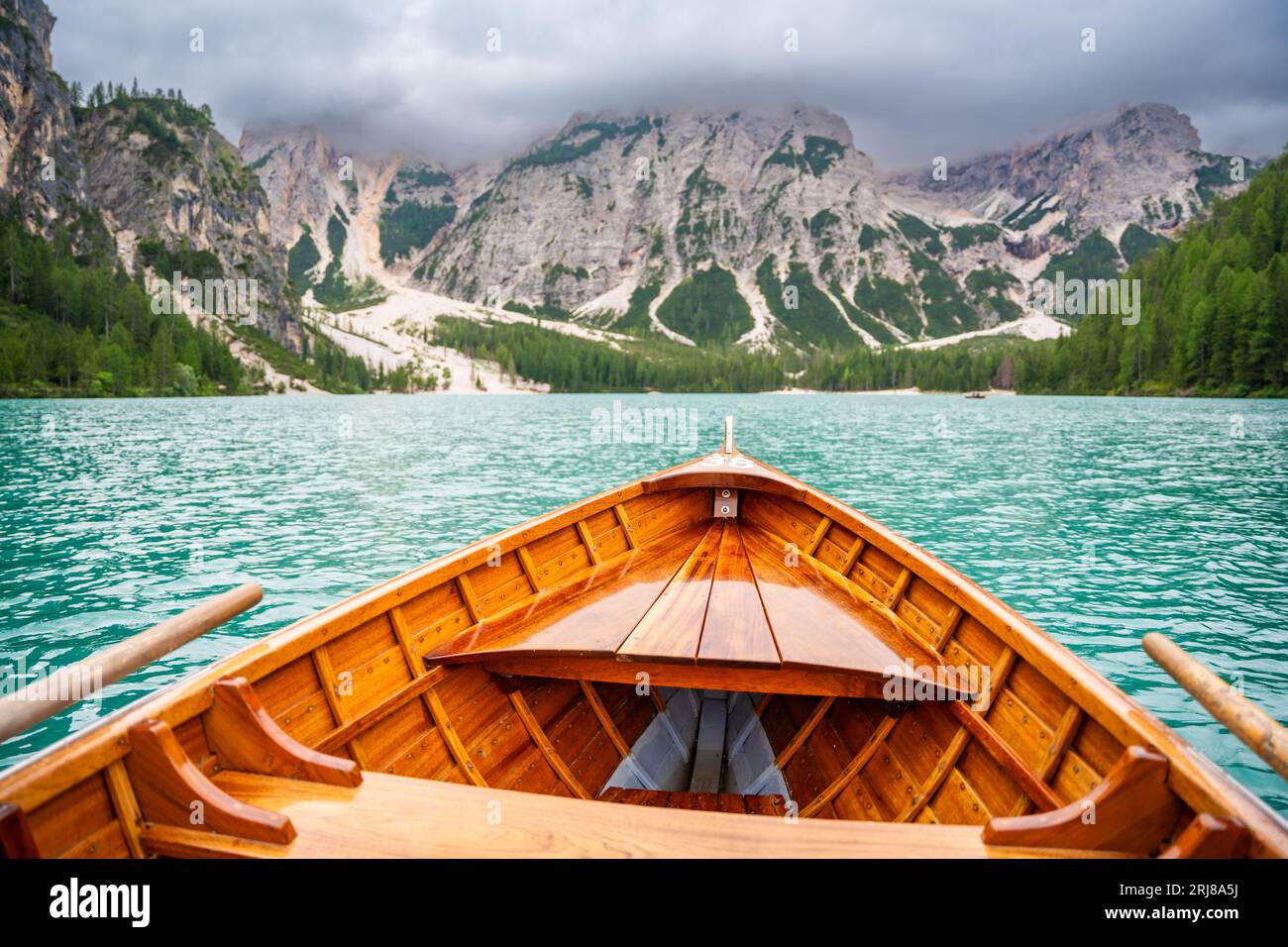 Traditional wooden rowing boat on scenic Lago di Braies in the ...