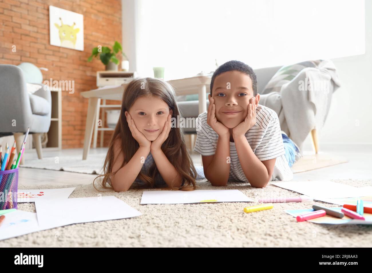 Cute little children drawing at home Stock Photo - Alamy