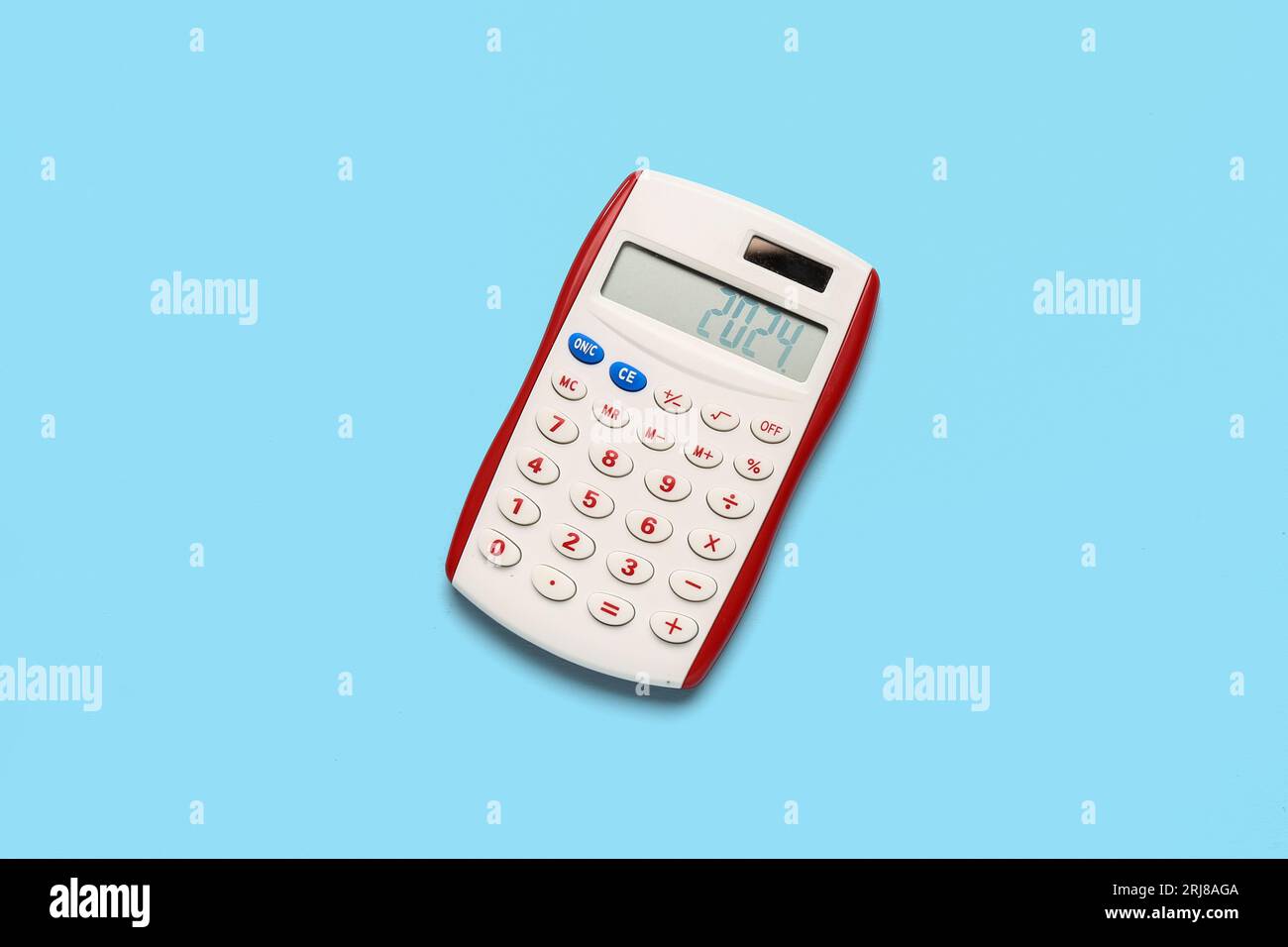 Calculator with number 2024 on blue background Stock Photo - Alamy