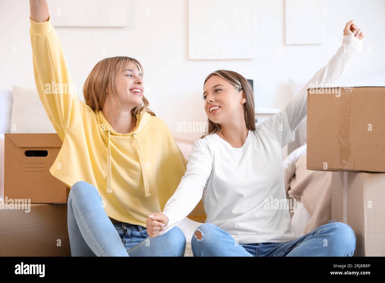 Female students with boxes in dorm room on moving day Stock Photo - Alamy