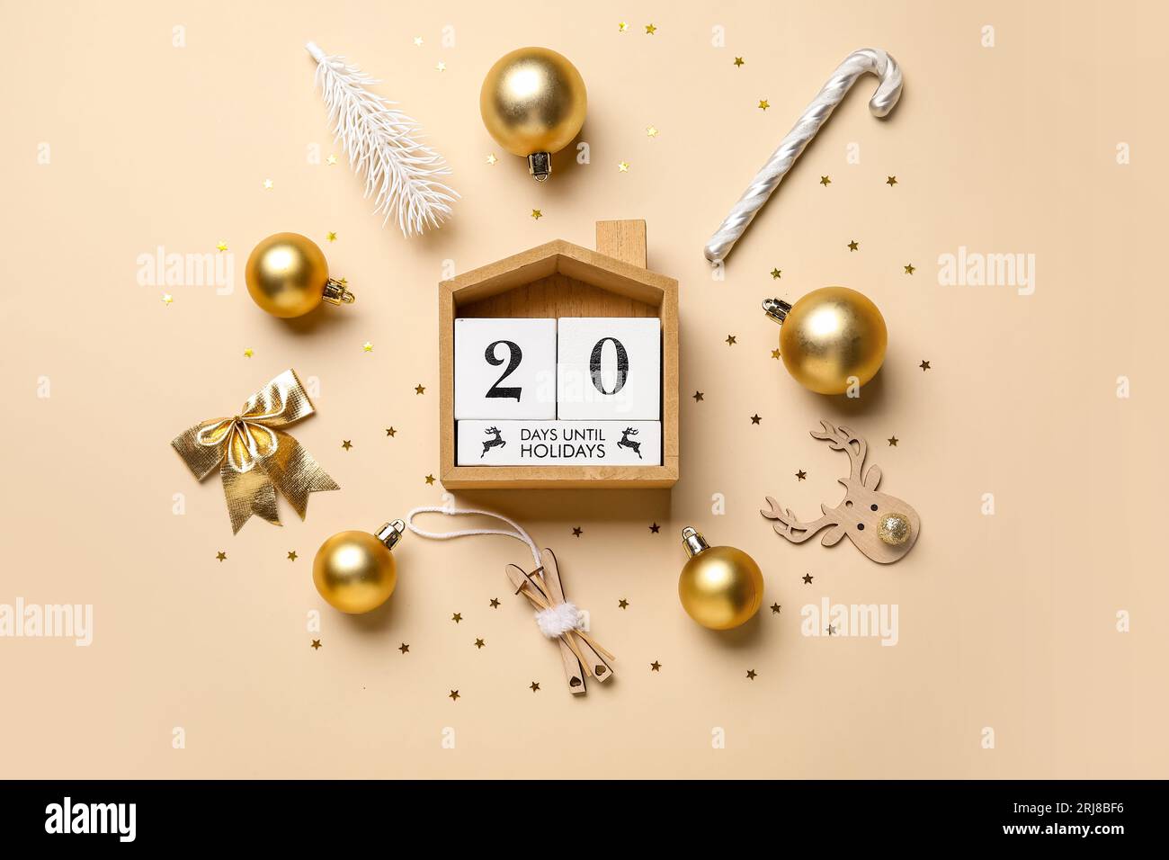 Calendar with text 20 DAYS UNTIL HOLIDAYS and Christmas decor on beige ...
