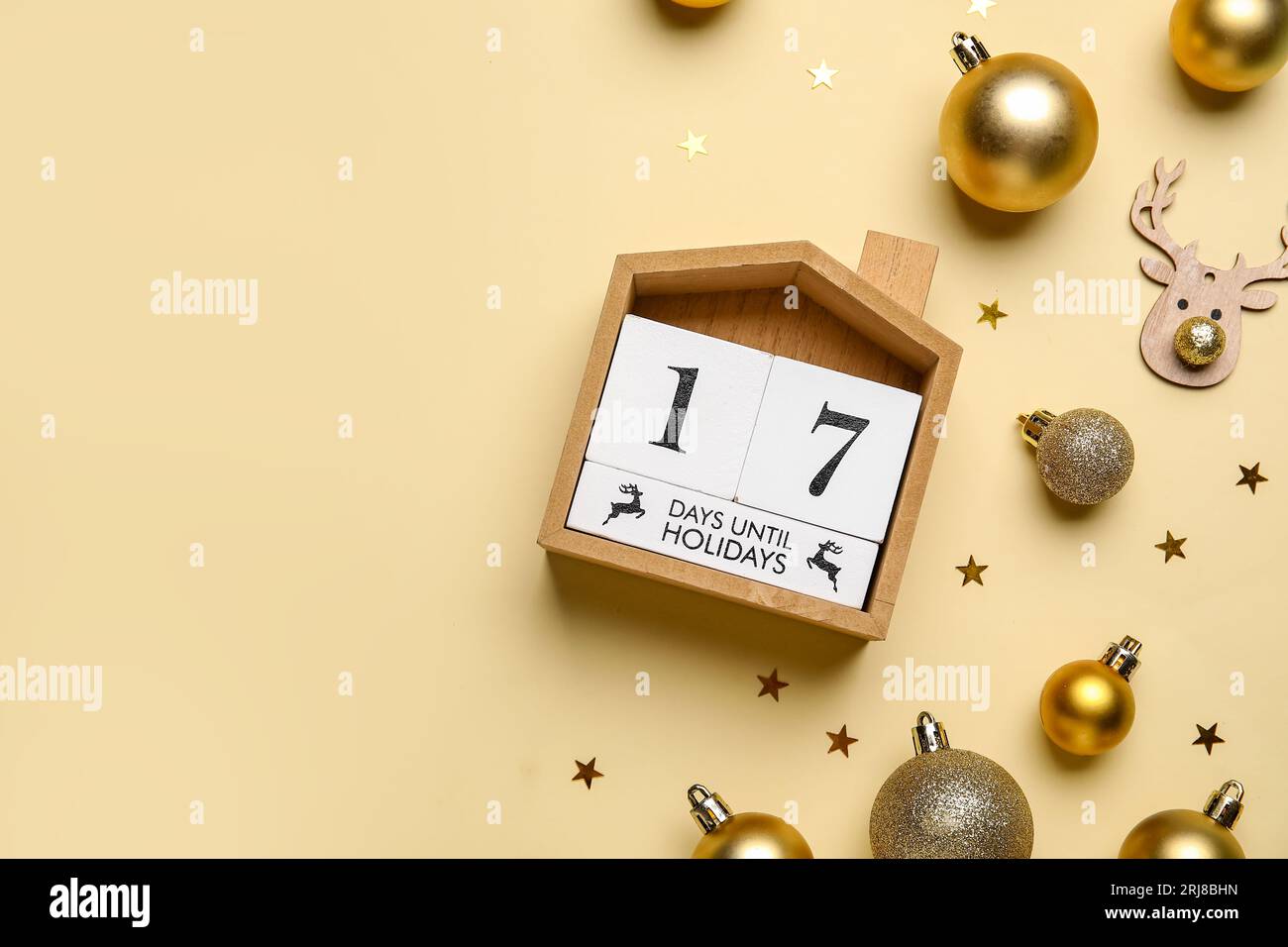 Calendar with text 17 DAYS UNTIL HOLIDAYS and Christmas decor on beige ...