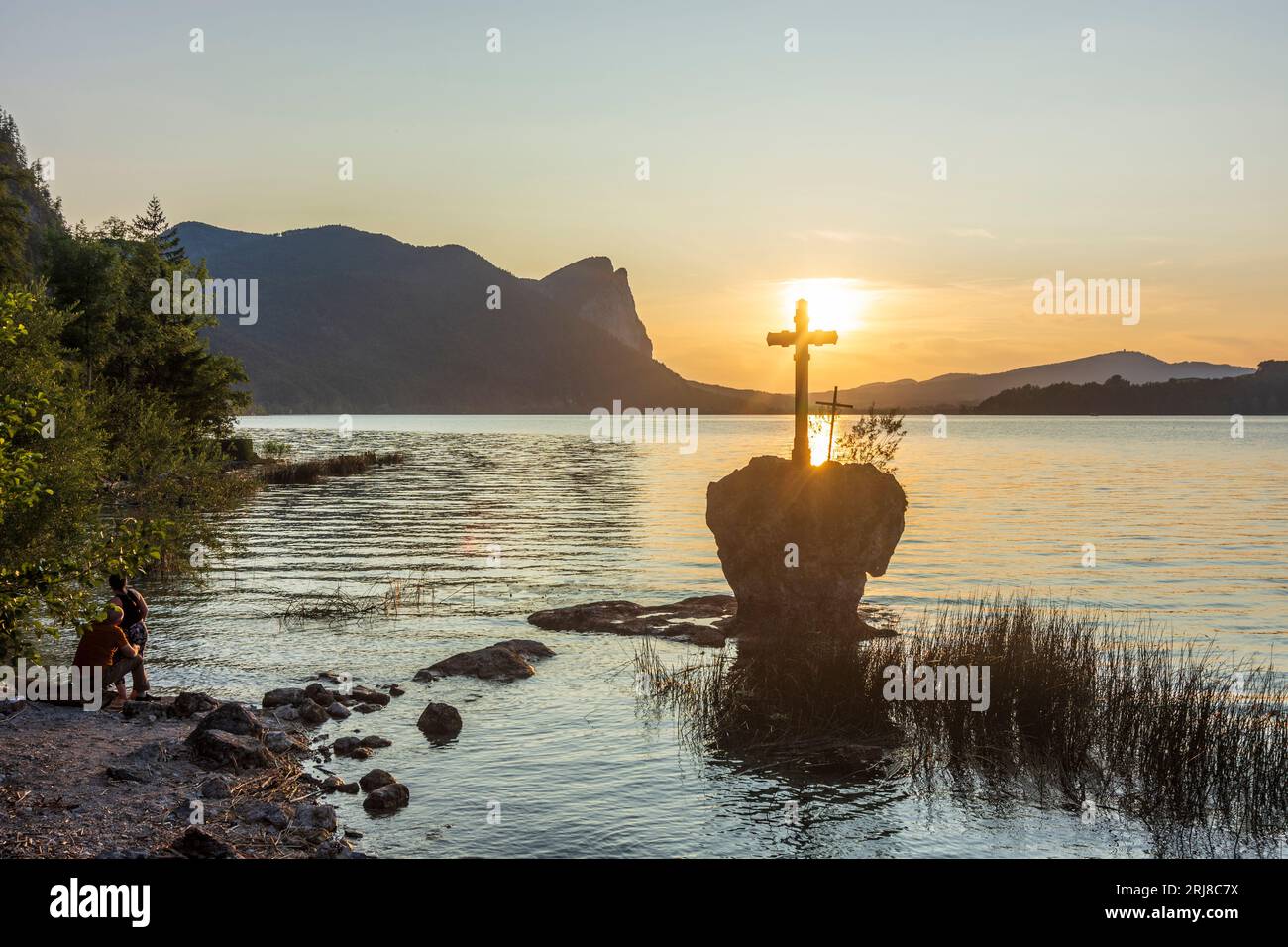 Mondsee: lake Mondsee, boulder with cross Kreuzstein, rock face ...