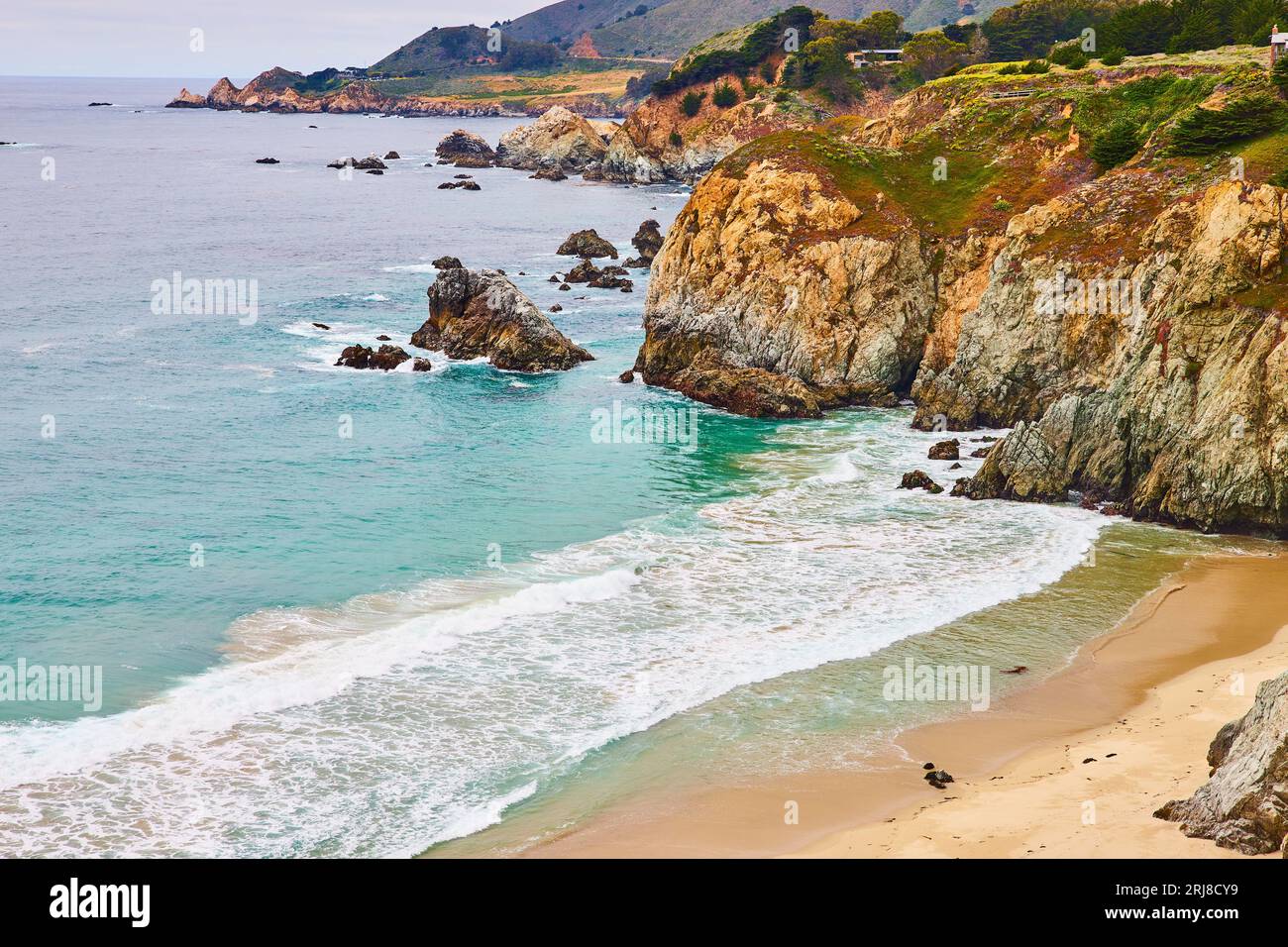 Beautiful ocean waves crashing against shoreline with yellow faced ...