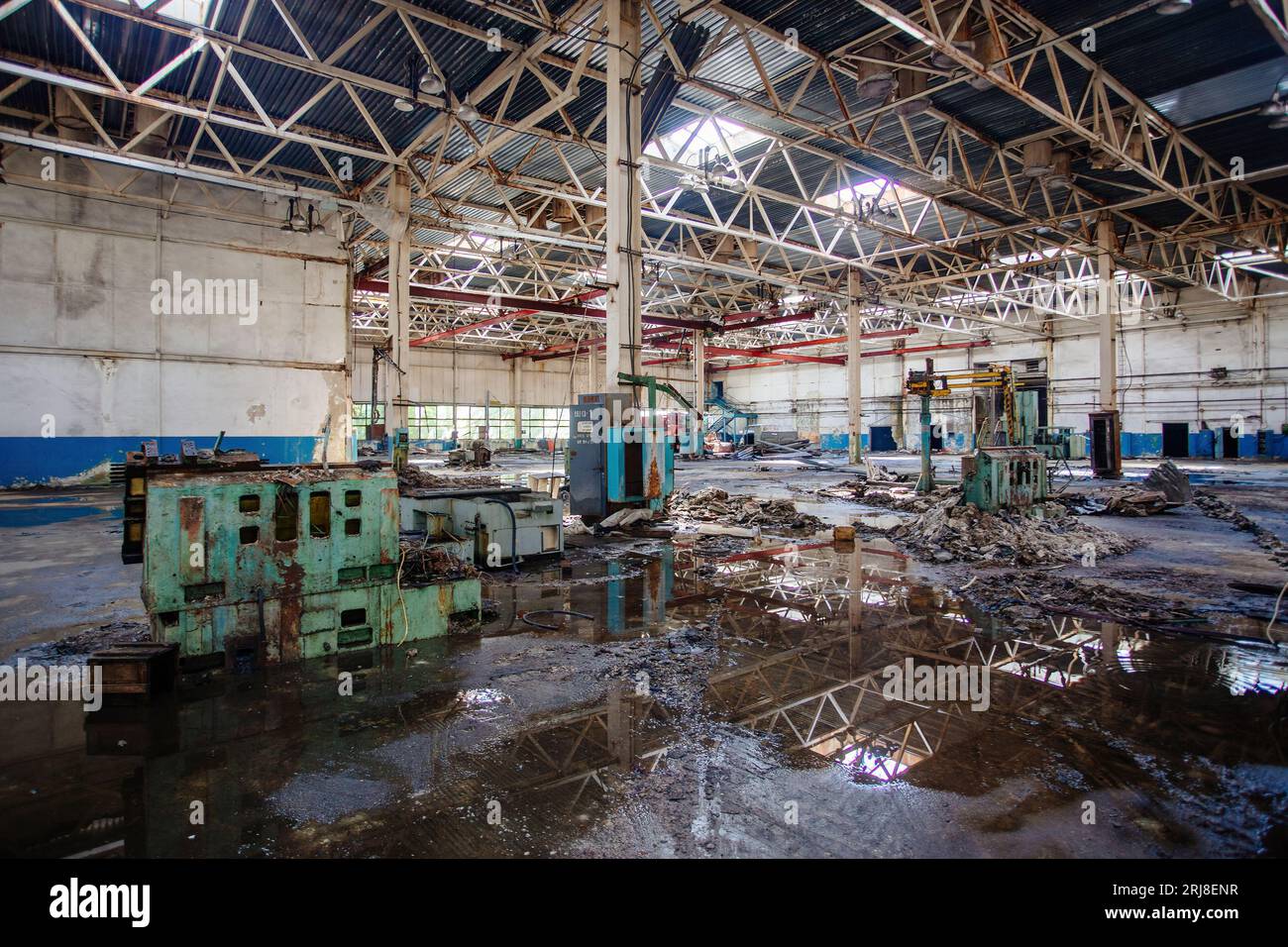 Abandoned factory. Large empty ruined industrial hall with broken ...