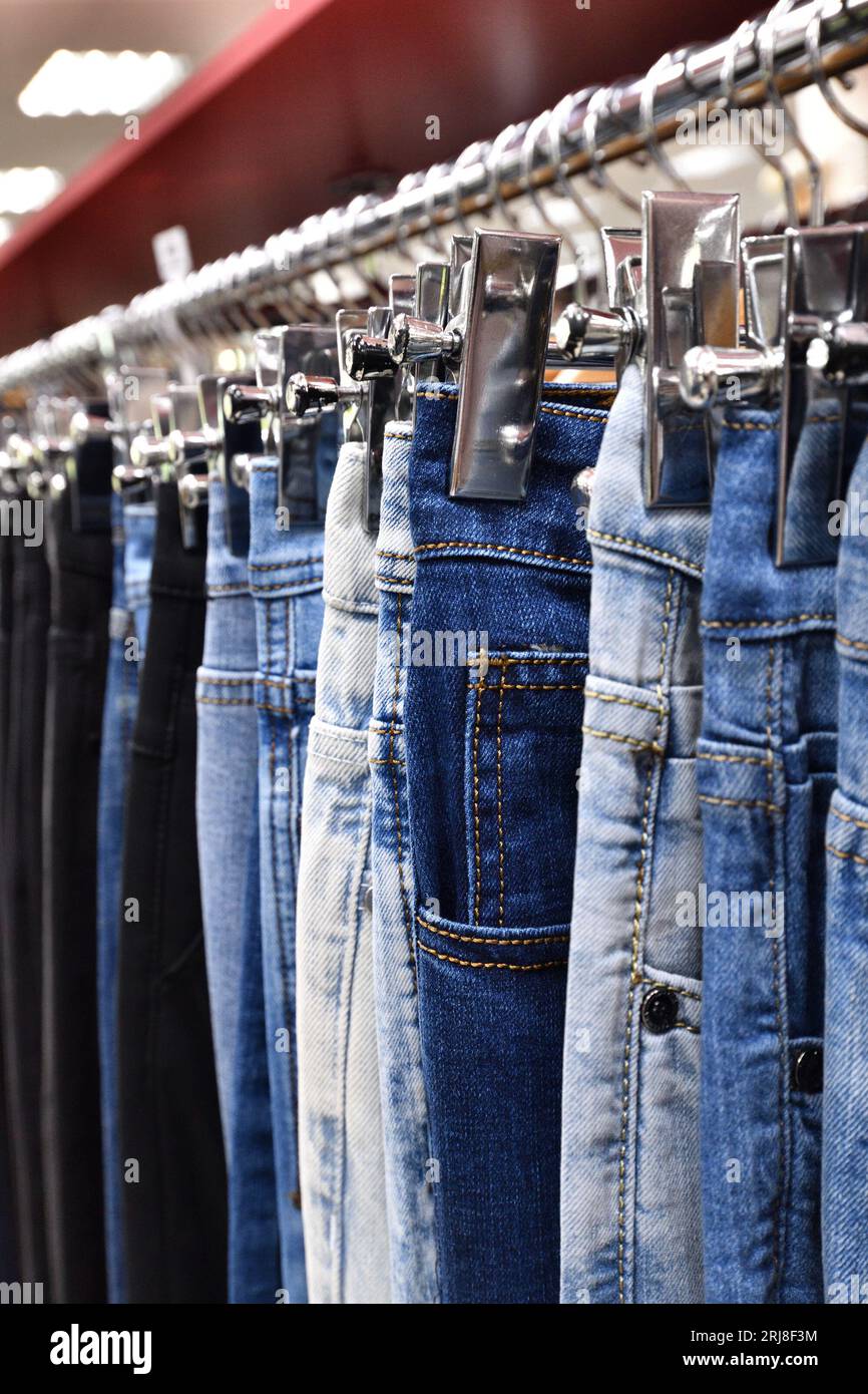 Pants hanging on hanger in hi-res stock photography and images - Alamy