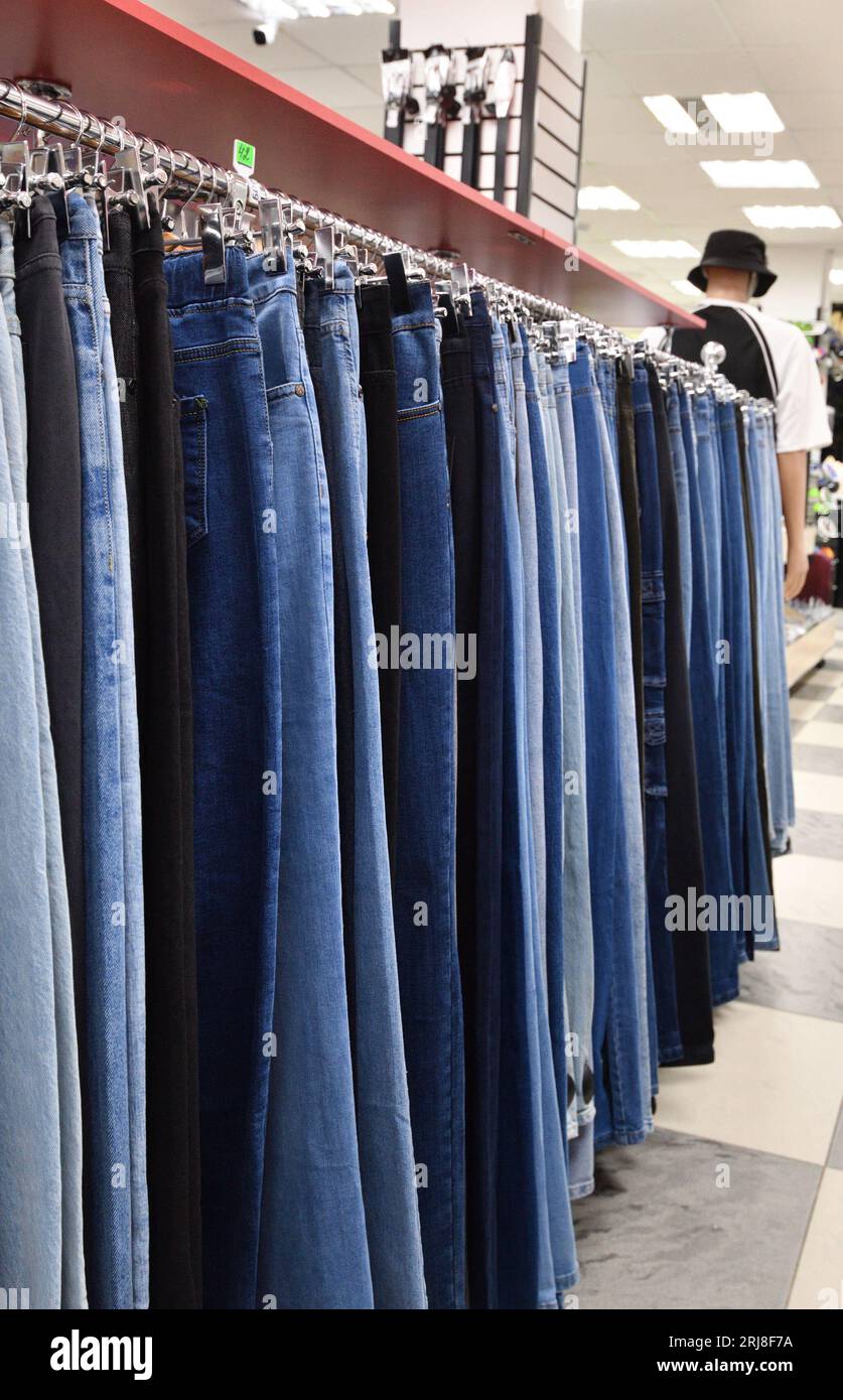 Pants hanging on hanger in hi-res stock photography and images - Alamy