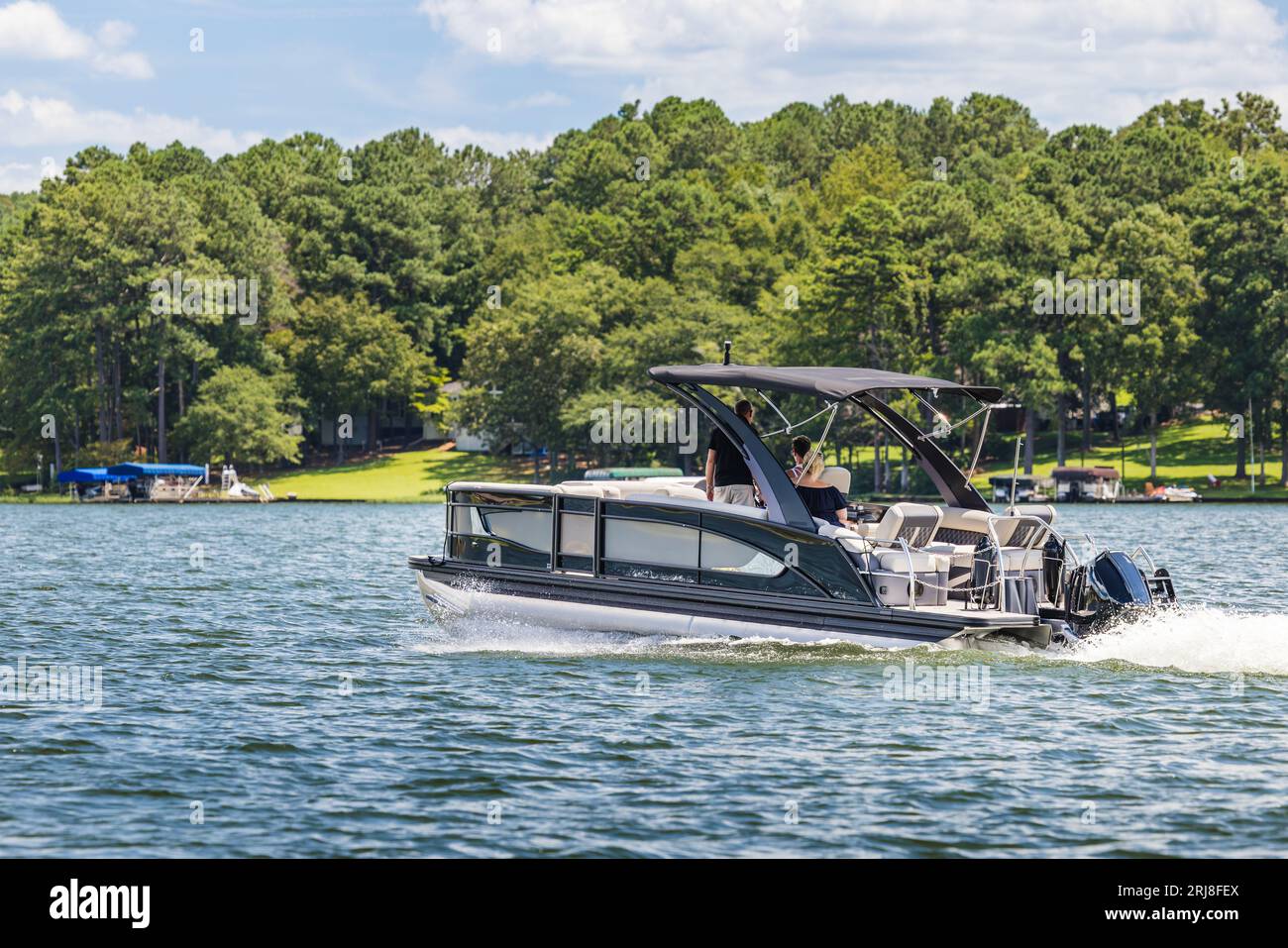Boaters on pontoon boat enjoying summer day on Lake. Pontoon party boat ...