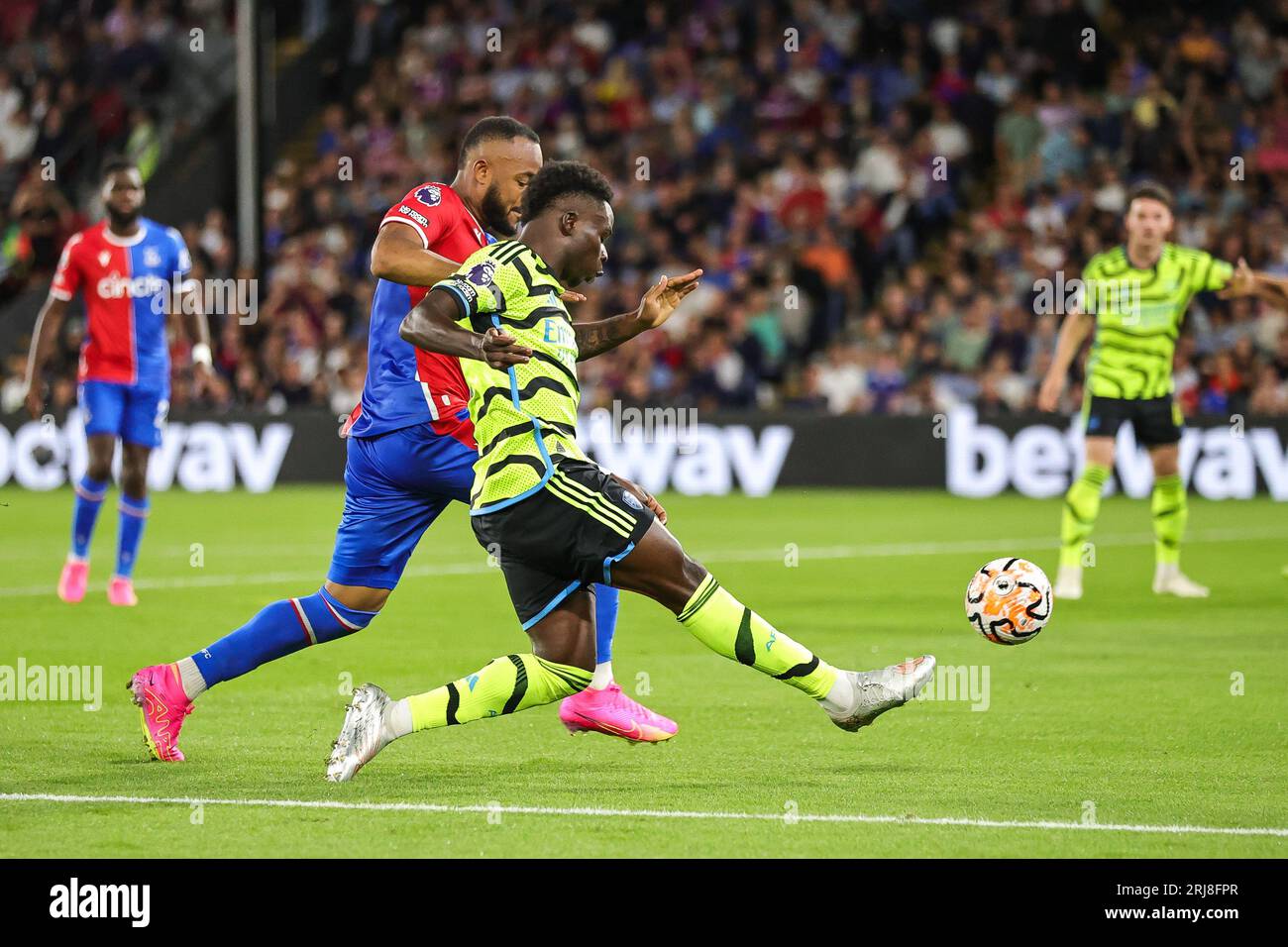 Bukayo Saka #7 of Arsenal crosses the ball during the Premier League ...