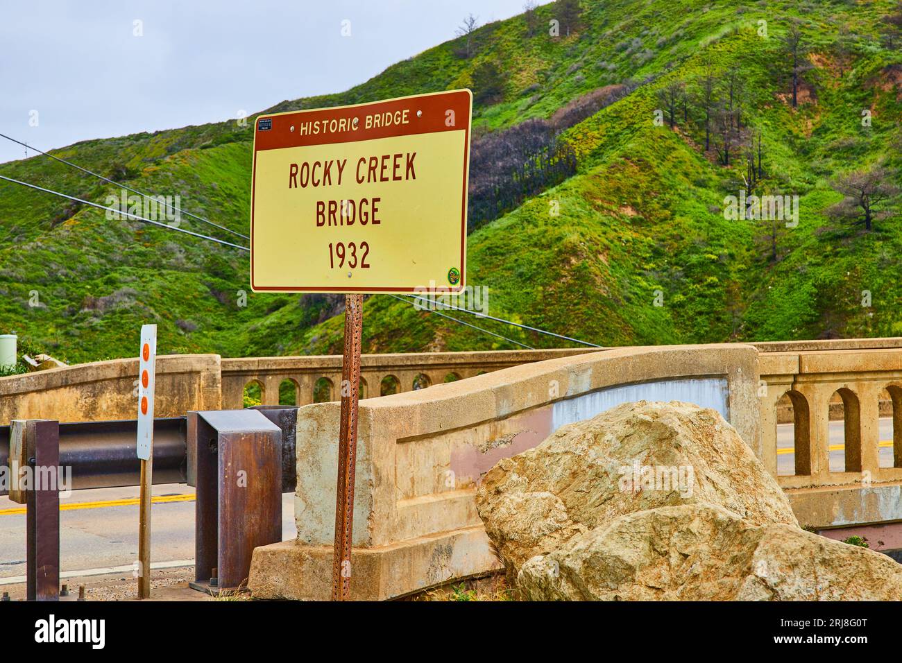 Rocky Creek Bridge 1932 sign at entrance to Historic Bridge with green ...