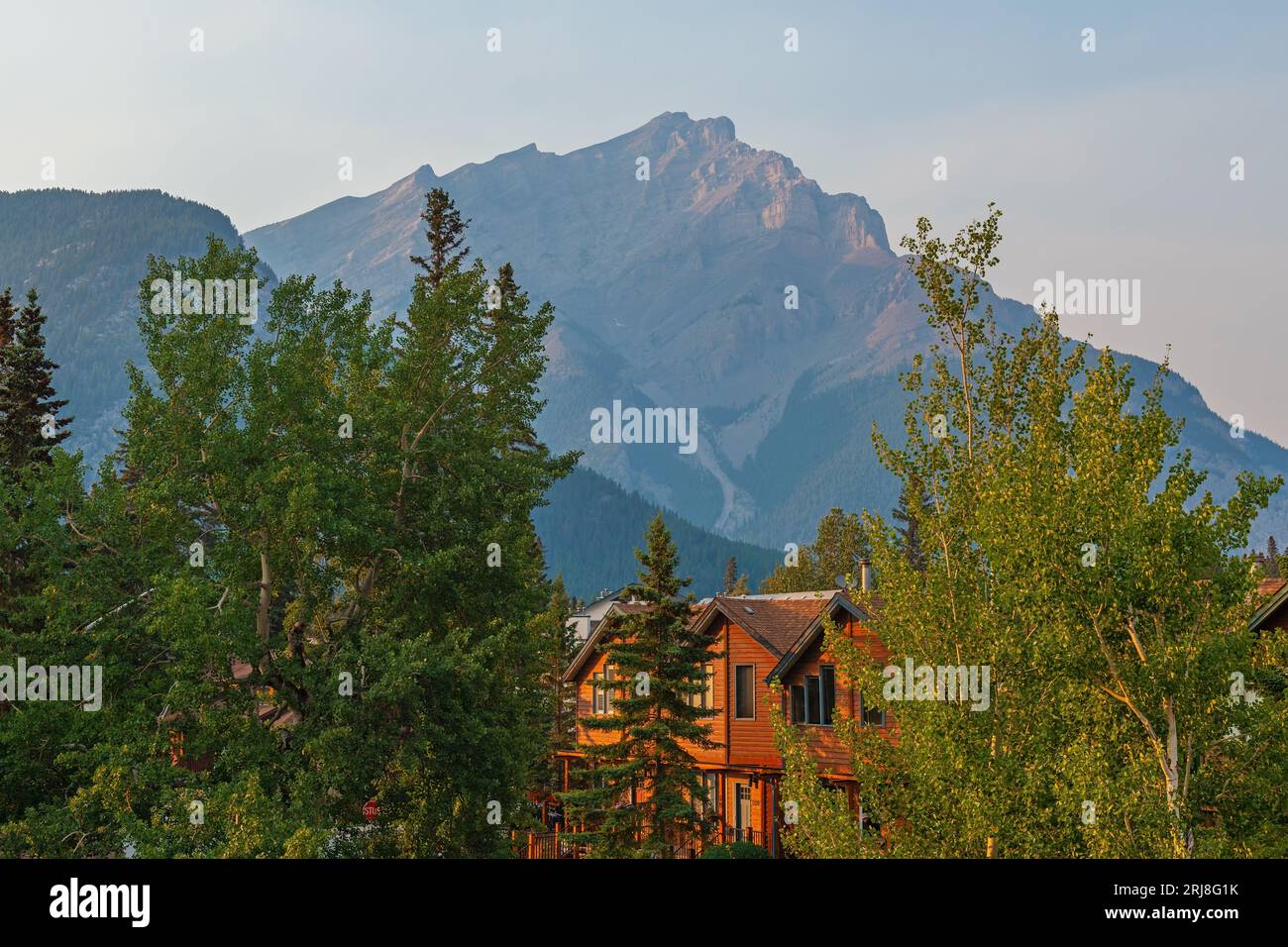 Sunrise in Banff with traditional wooden alpine architecture, Banff ...